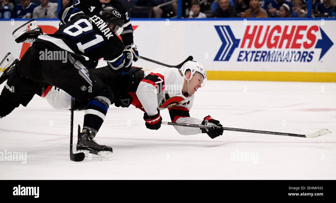 Ottawa Senators left wing Brady Tkachuk (7) gets tripped up as he ...