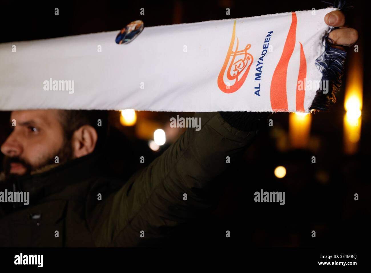 Beirut. 28th Mar, 2026. A man holds an Al Mayadeen scarf during a ...