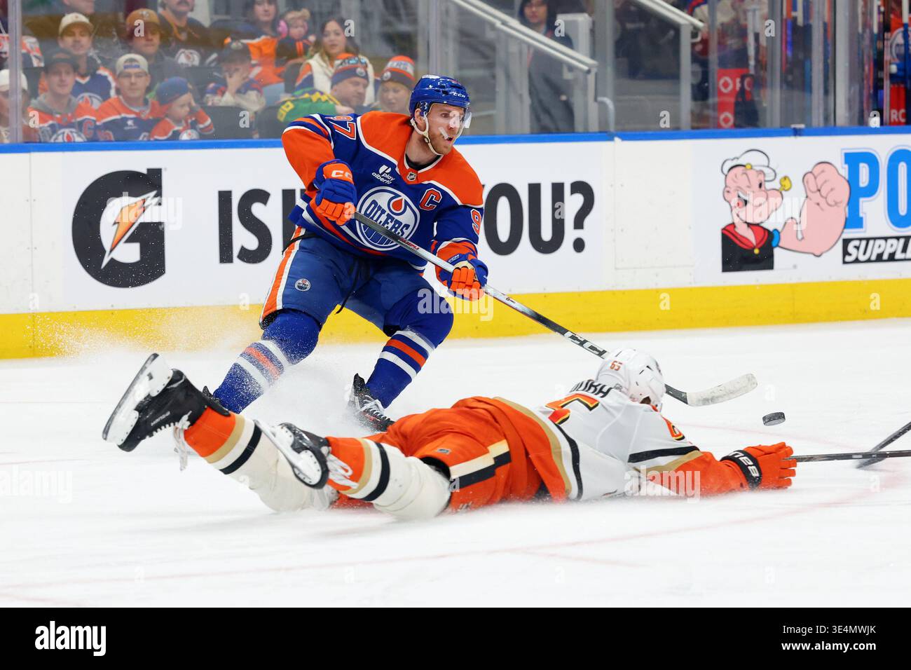 Anaheim Ducks' Jacob Trouba (65) slides in front of Edmonton Oilers ...