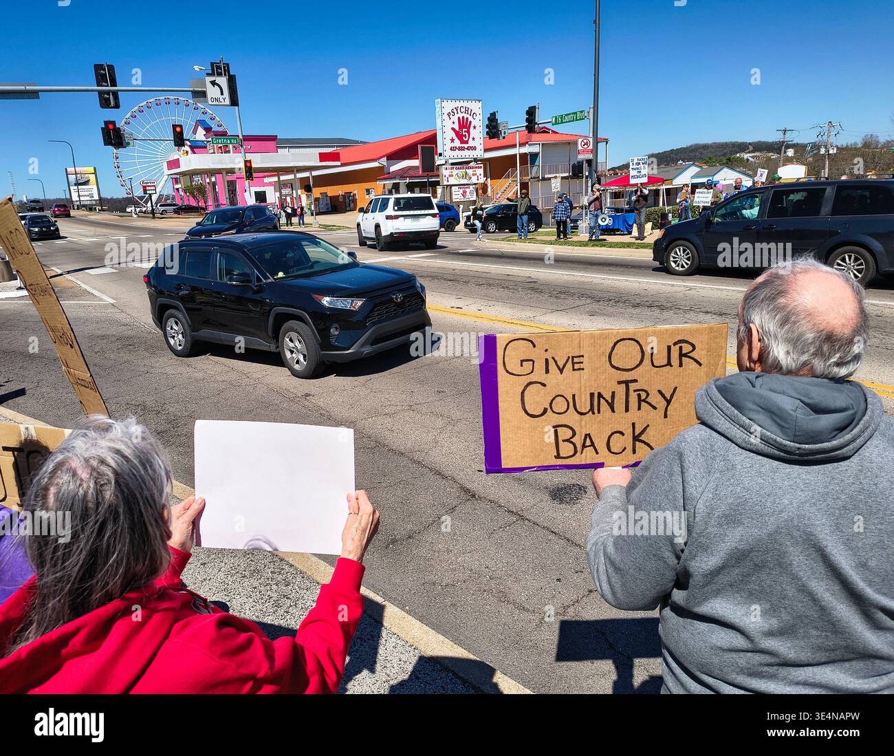 Branson, Missouri, USA. 28 Mar 2026. No Kings 3 protesters picket along ...