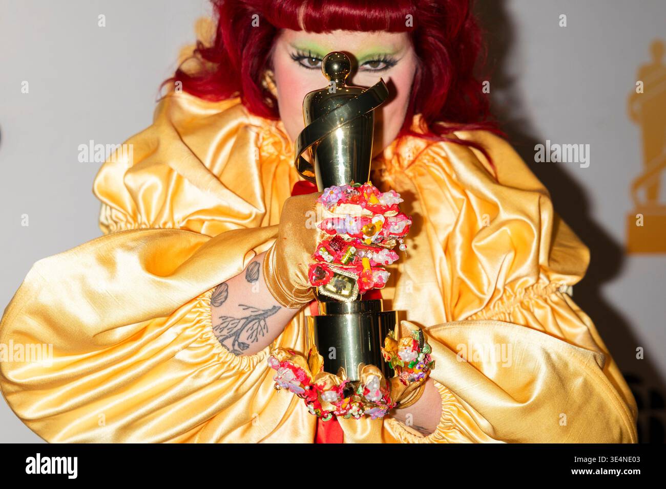 Begonia poses for photos after winning Adult Alternative Album of the ...