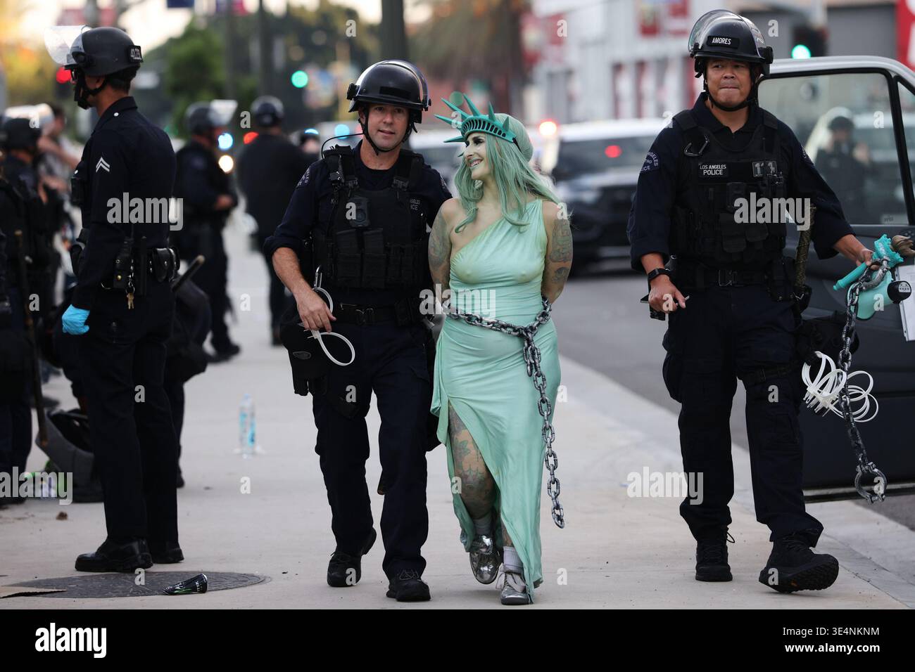 Police arrest a protestor dressed as the Statue of Liberty, in downtown ...