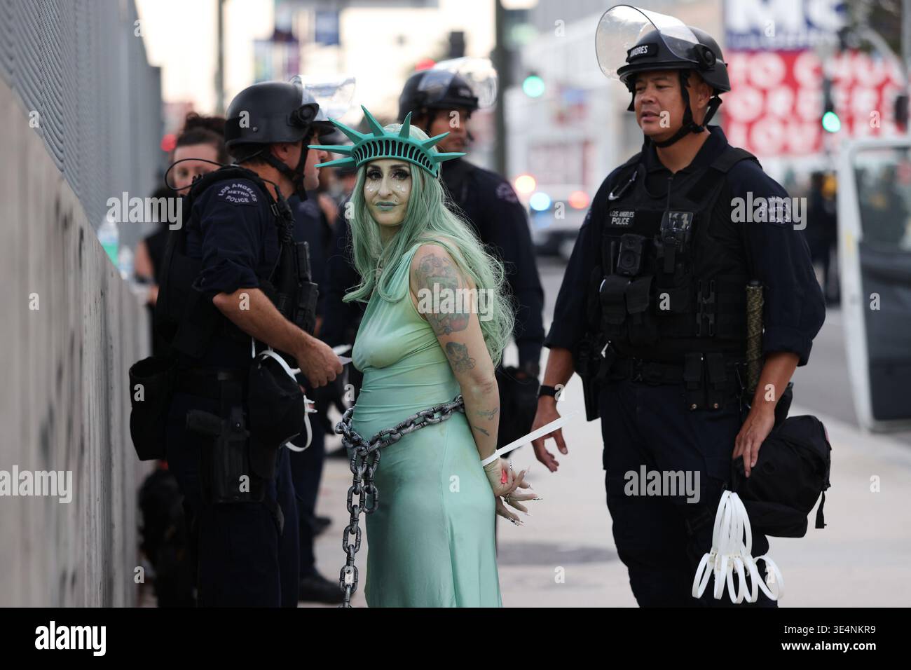 Police arrest a protestor dressed as the Statue of Liberty, in downtown ...