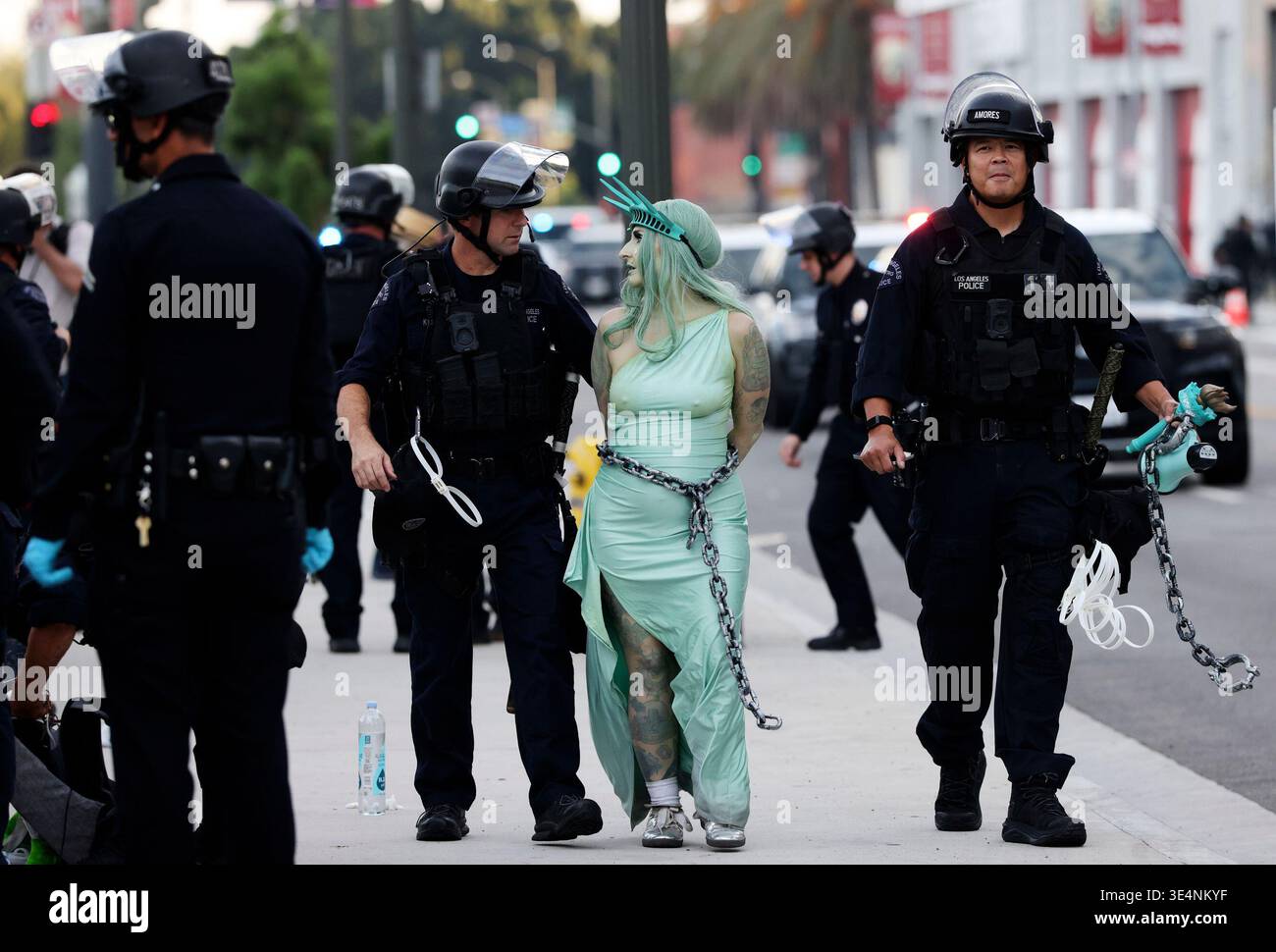 Police arrest a protestor dressed as the Statue of Liberty, in downtown ...
