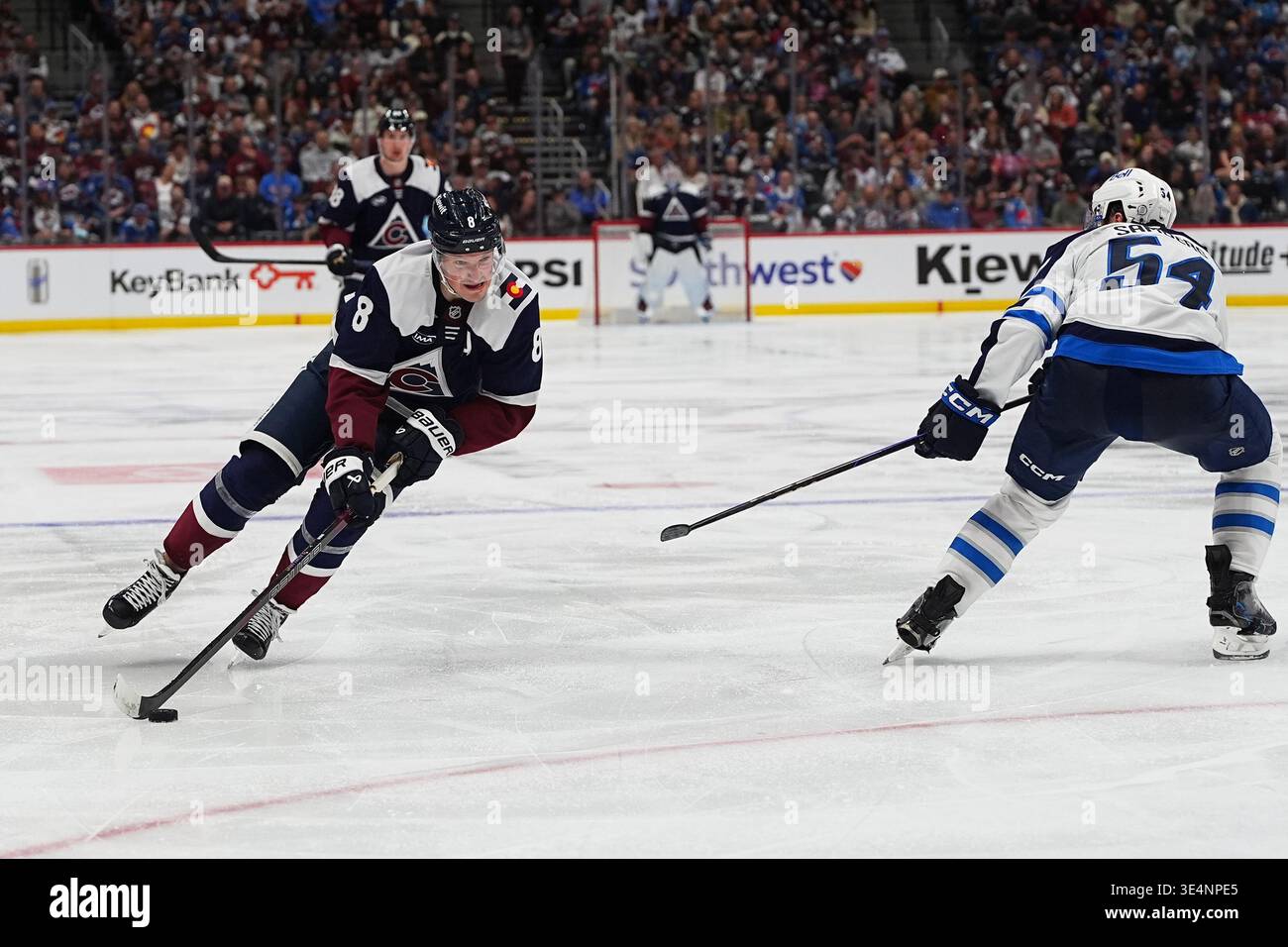 Colorado Avalanche defenseman Cale Makar, left, drives past Winnipeg ...