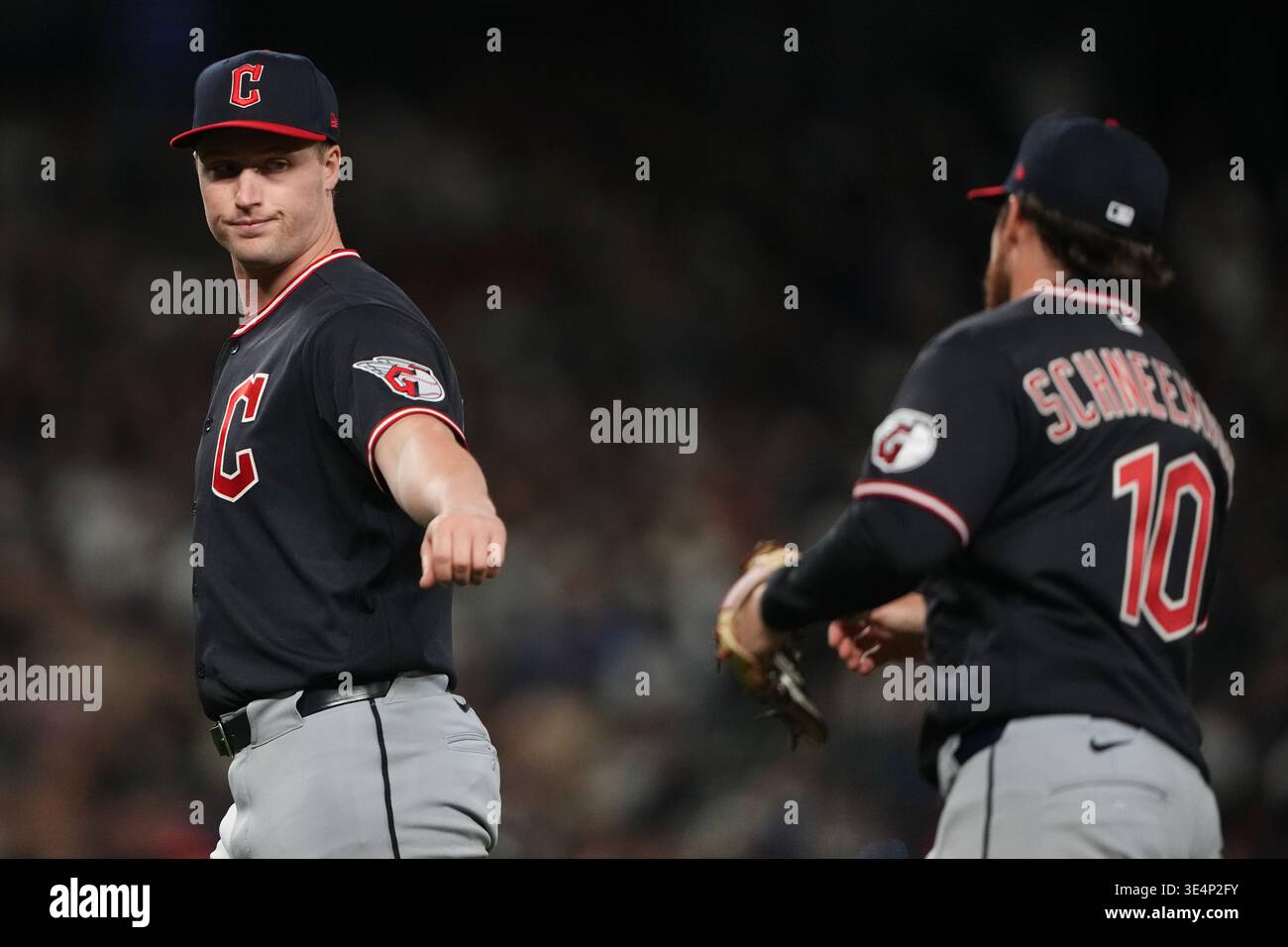 Cleveland Guardians relief pitcher Tim Herrin greets second baseman ...