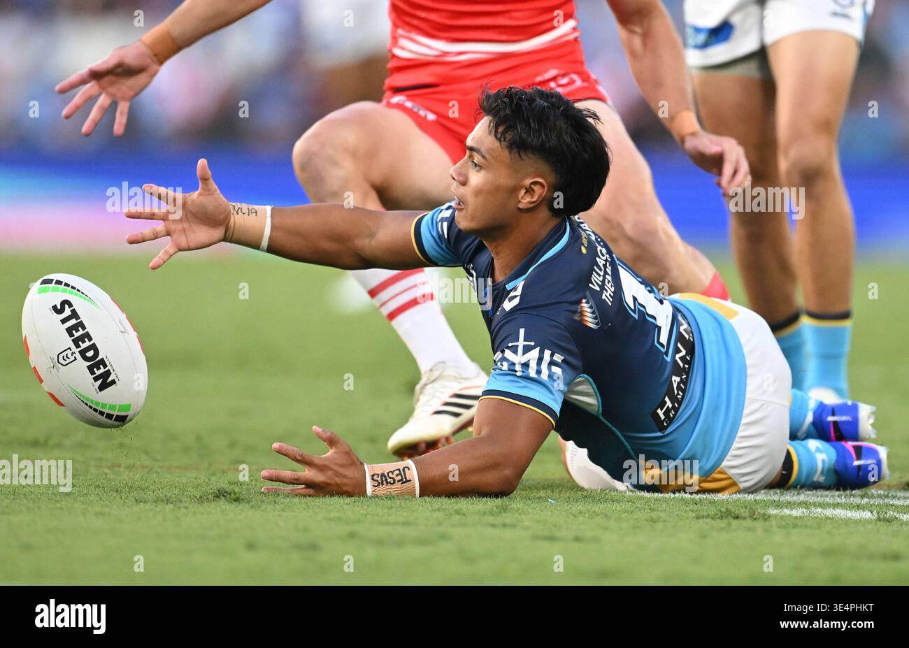 Keano Kini of the Titans knocks the ball on during the NRL Round 4 ...