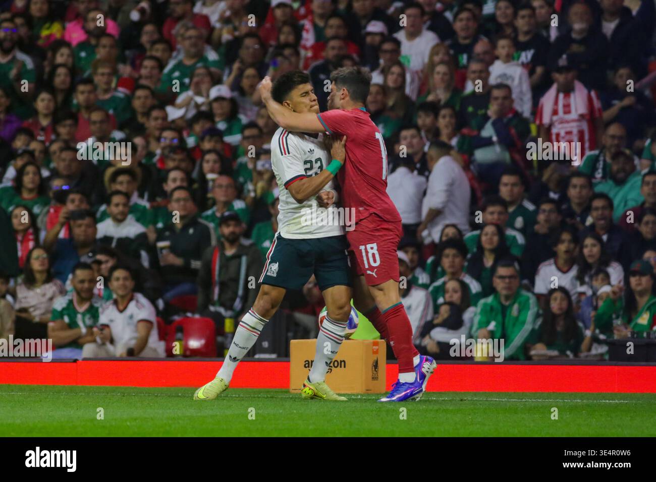 Jesús Gallardo #23 of Mexico fights whit Pedro Neto of Portugal during ...
