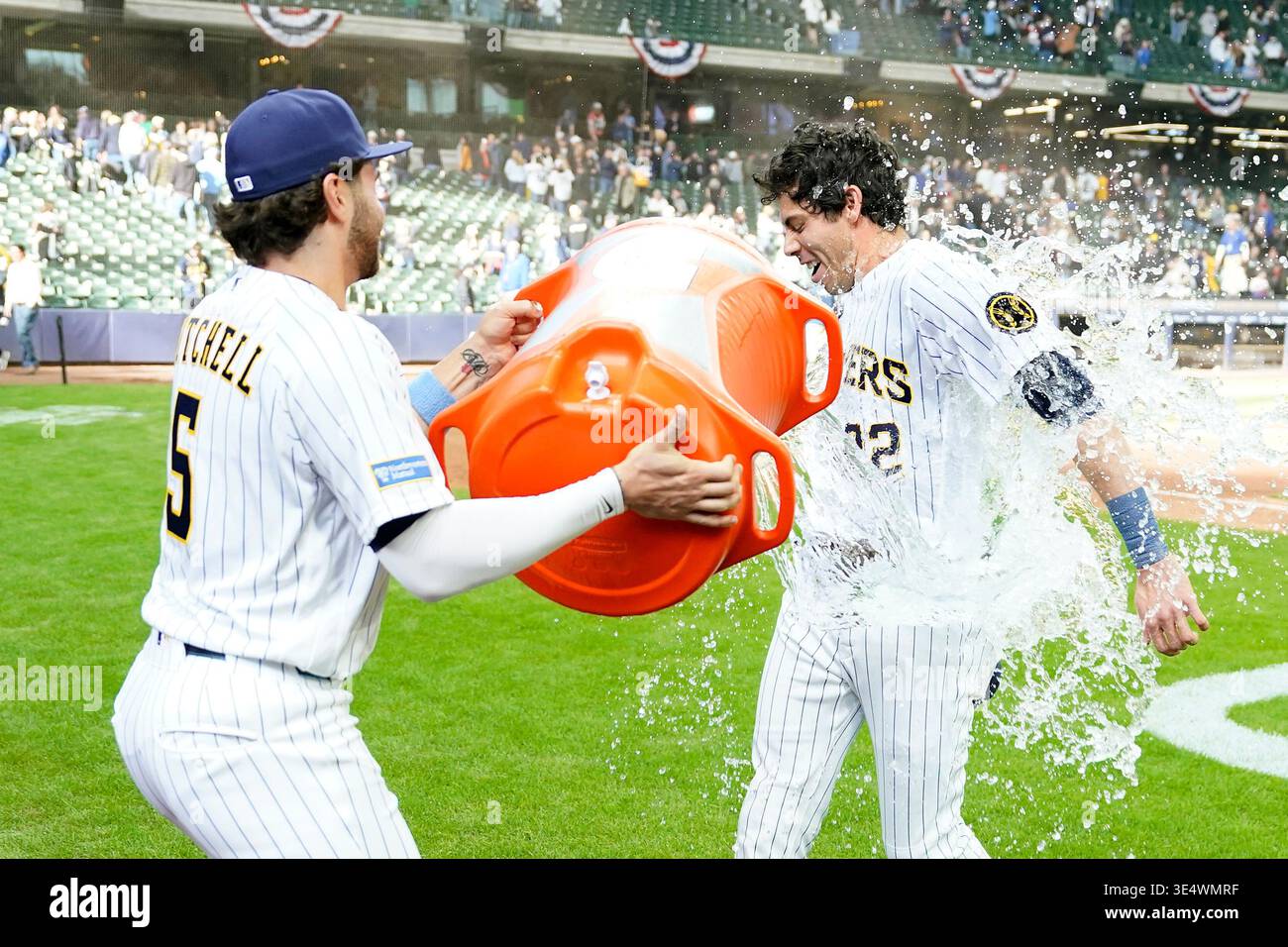 Milwaukee Brewers' Garrett Mitchell (5) douses Christian Yelich (22 ...