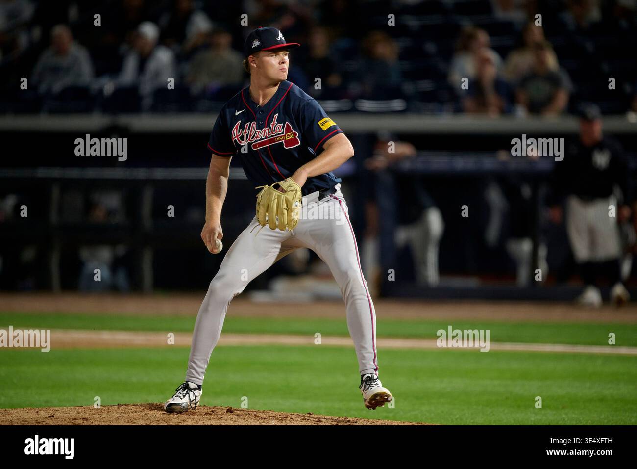 Atlanta Braves pitcher Garrett Baumann (90) delivers a pitch during an ...