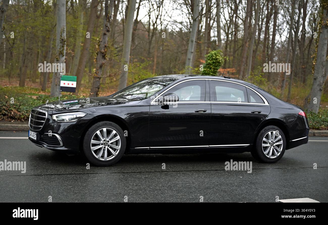 Berlin, Germany. 30th Mar, 2026. A limousine with a Syrian flag drives ...