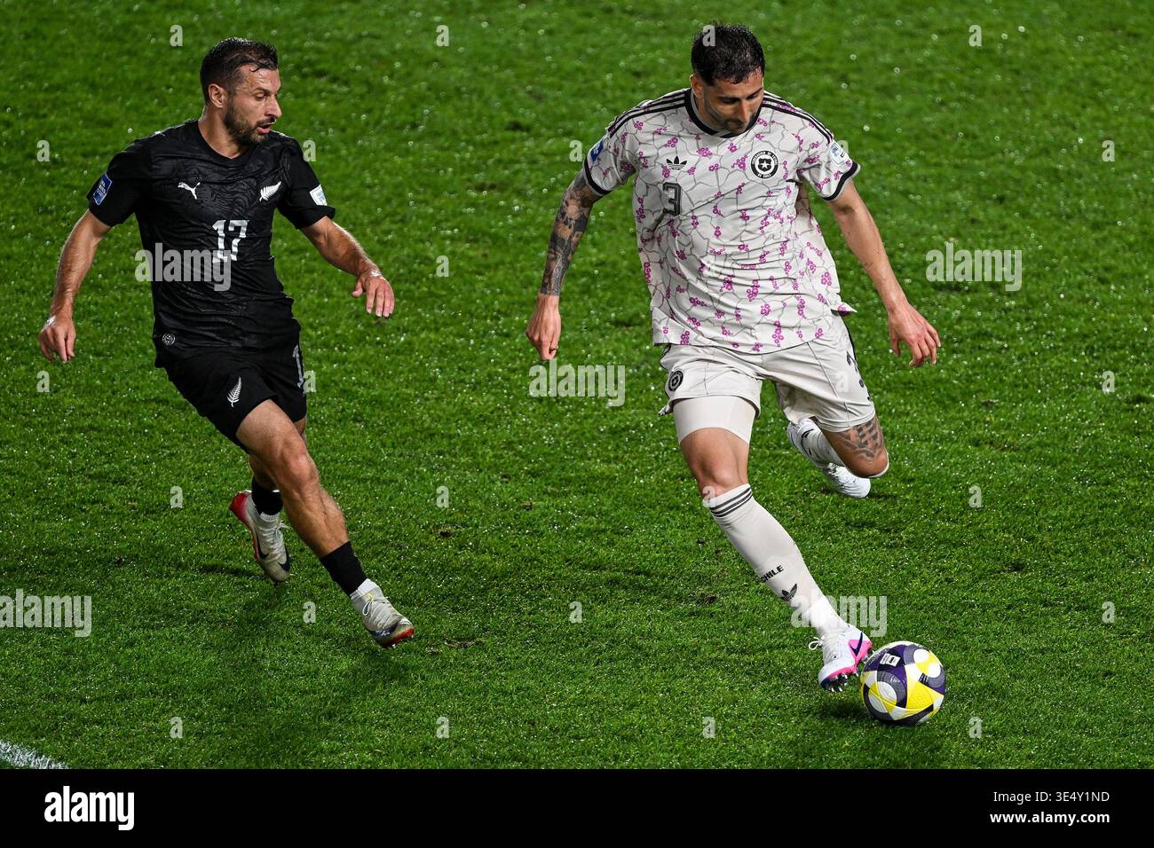Kosta Barbarouses, left, of New Zealand and Guillermo Maripan of Chile ...