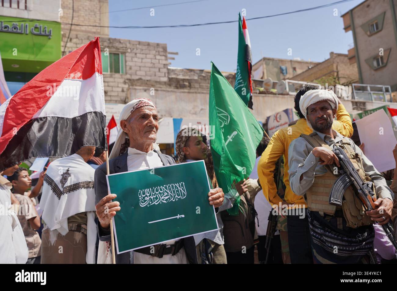Protesters hold Yemeni and Saudi flags during a march to protest ...