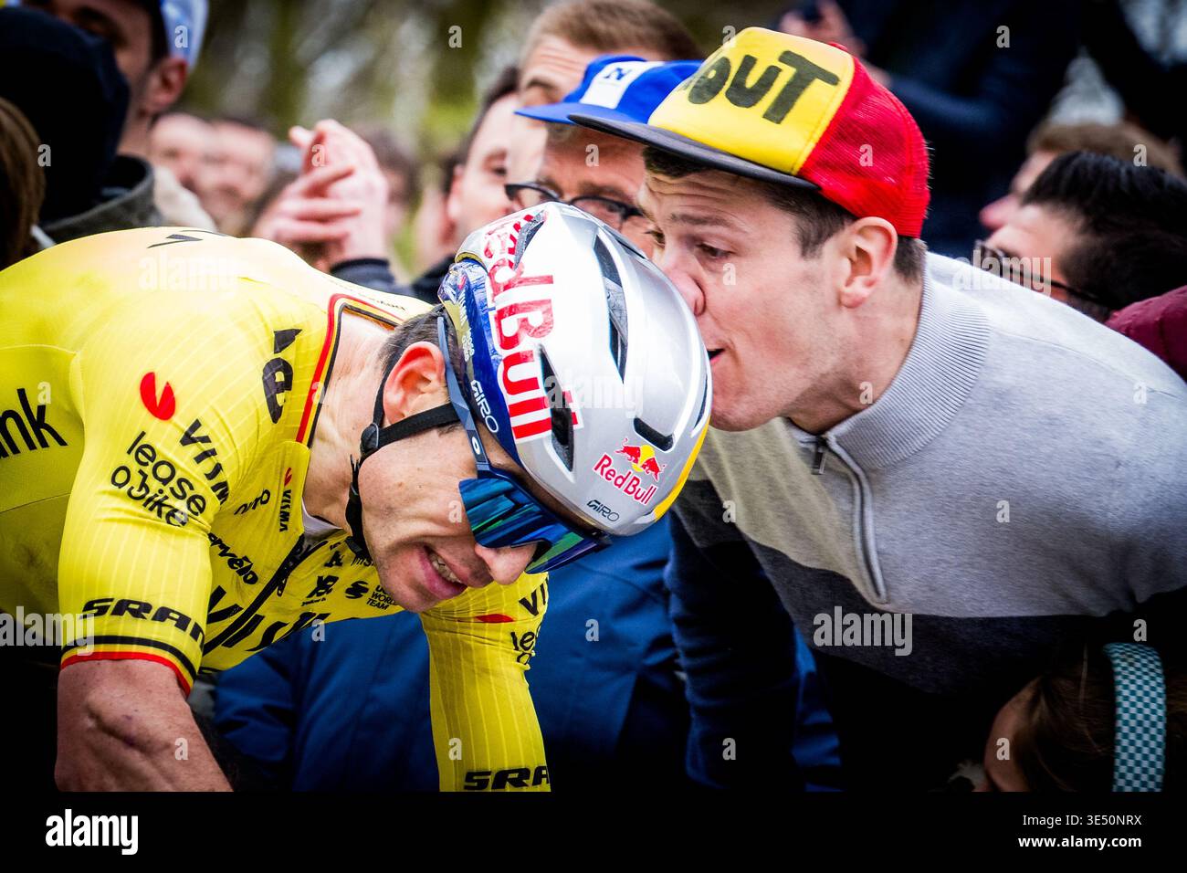 Belgian Wout van Aert and a supporter touching him with his nose ...
