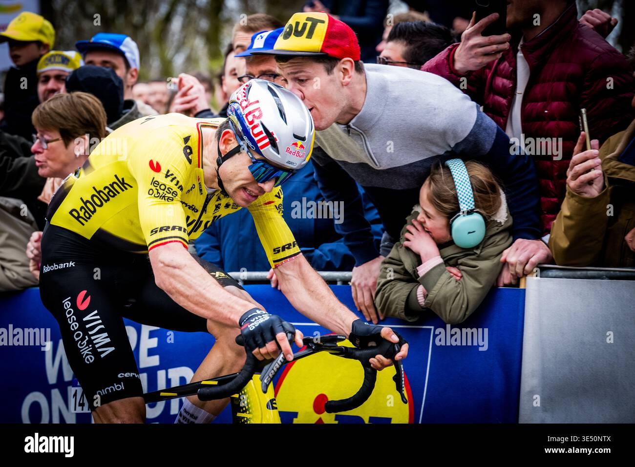 Belgian Wout van Aert and a supporter touching him with his nose ...