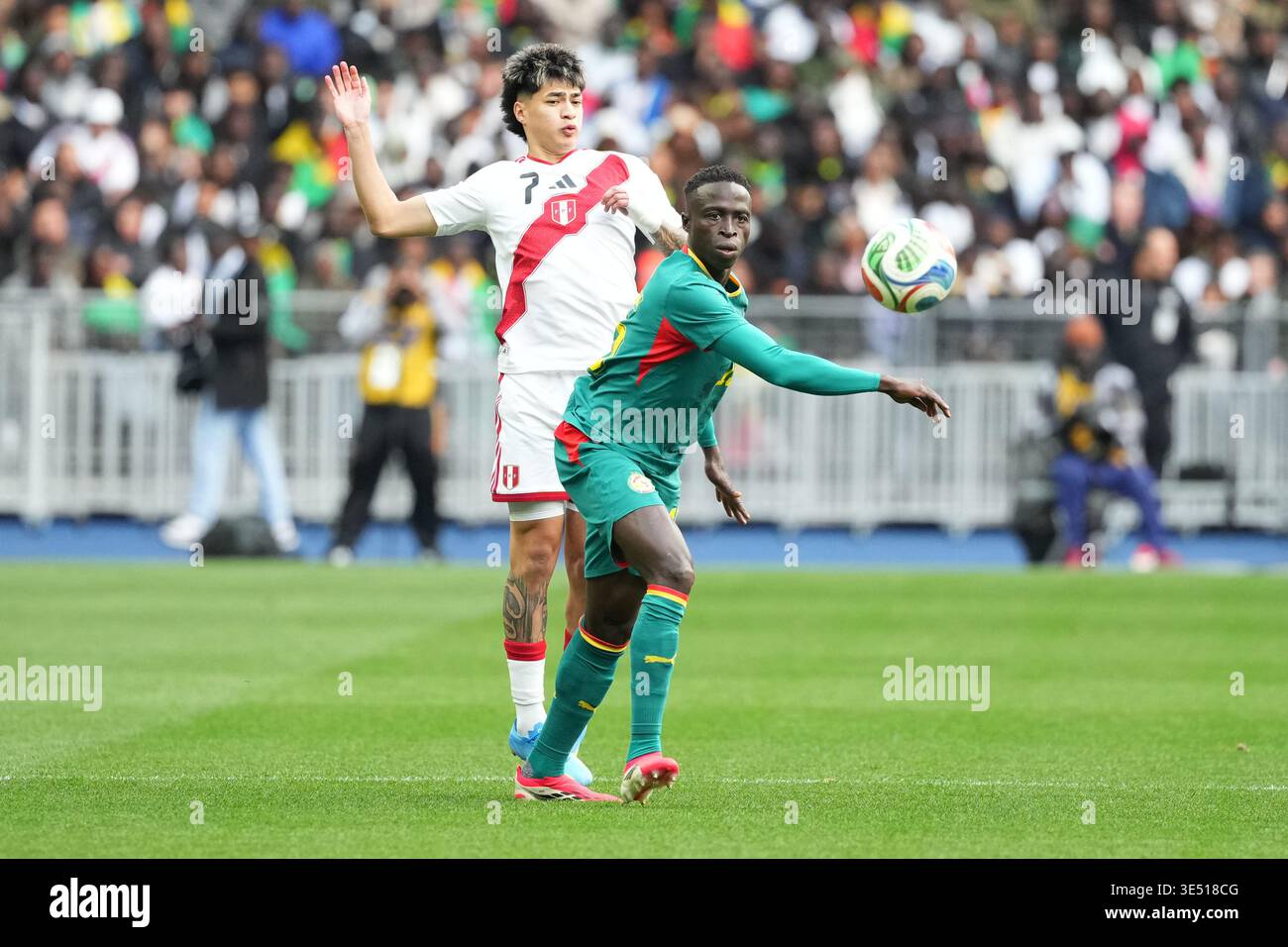 Krepin Diatta of Senegal holds off Giovanni Cabrera of Peru during ...