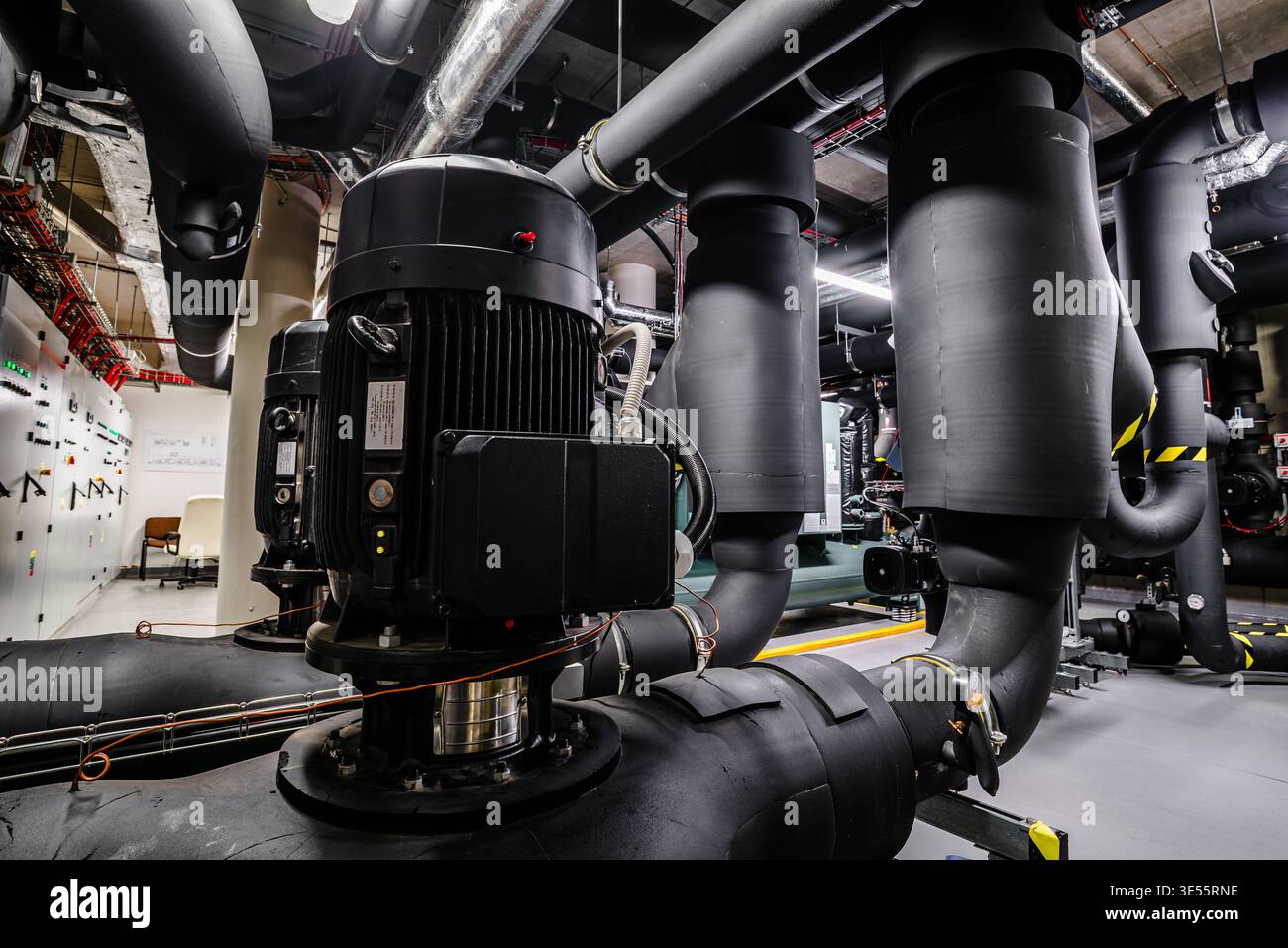 Interior of an industrial HVAC plant room featuring large insulated ...