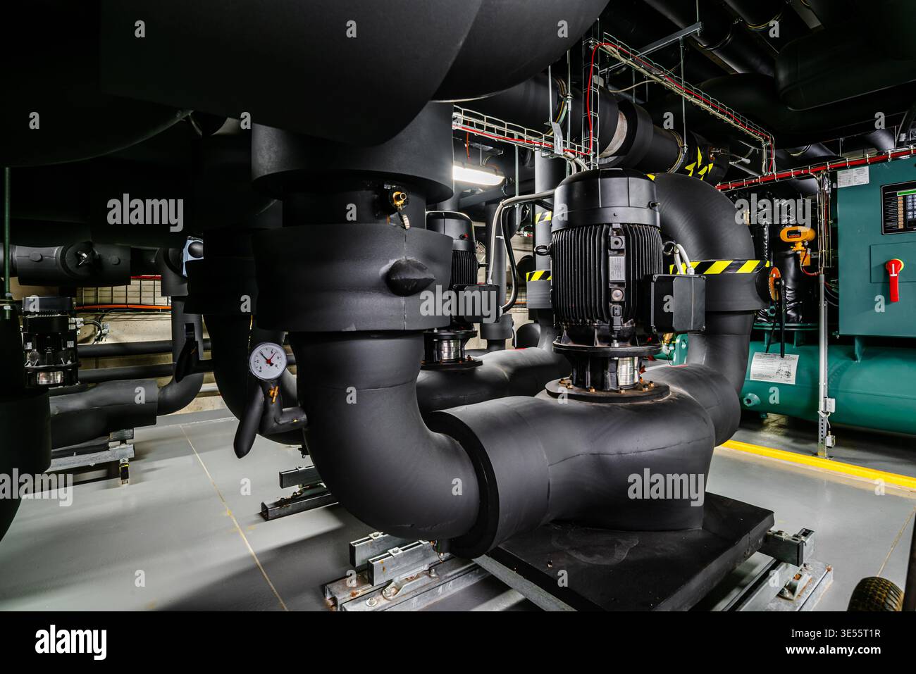 Interior of an industrial HVAC plant room featuring large insulated ...