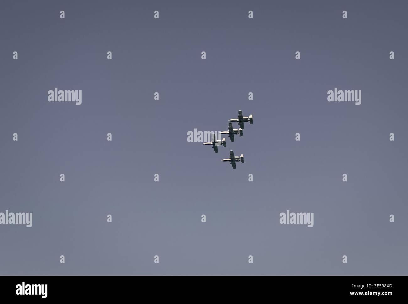 Military air force fighter jet airplane in full flight against blue sky ...