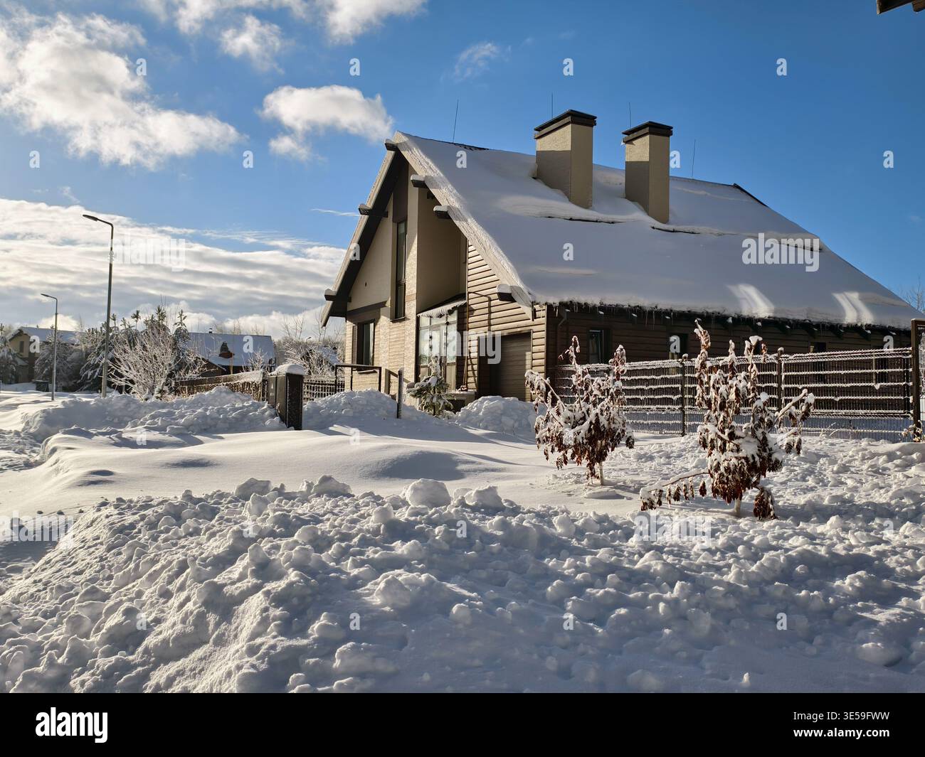 Snow-covered country garden in a siberian cottage village Stock Photo ...