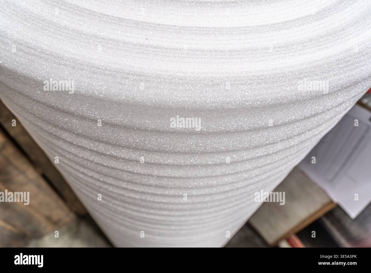 Roll of white packaging foam for customer orders Stock Photo - Alamy
