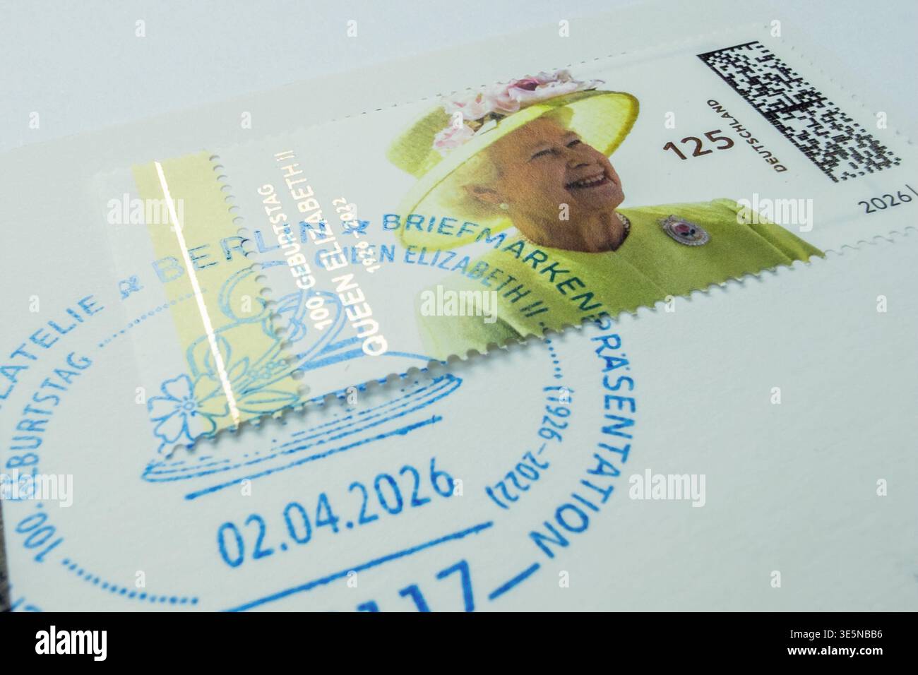 02 April 2026, Berlin: A Queen's postage stamp is stuck to a letter ...