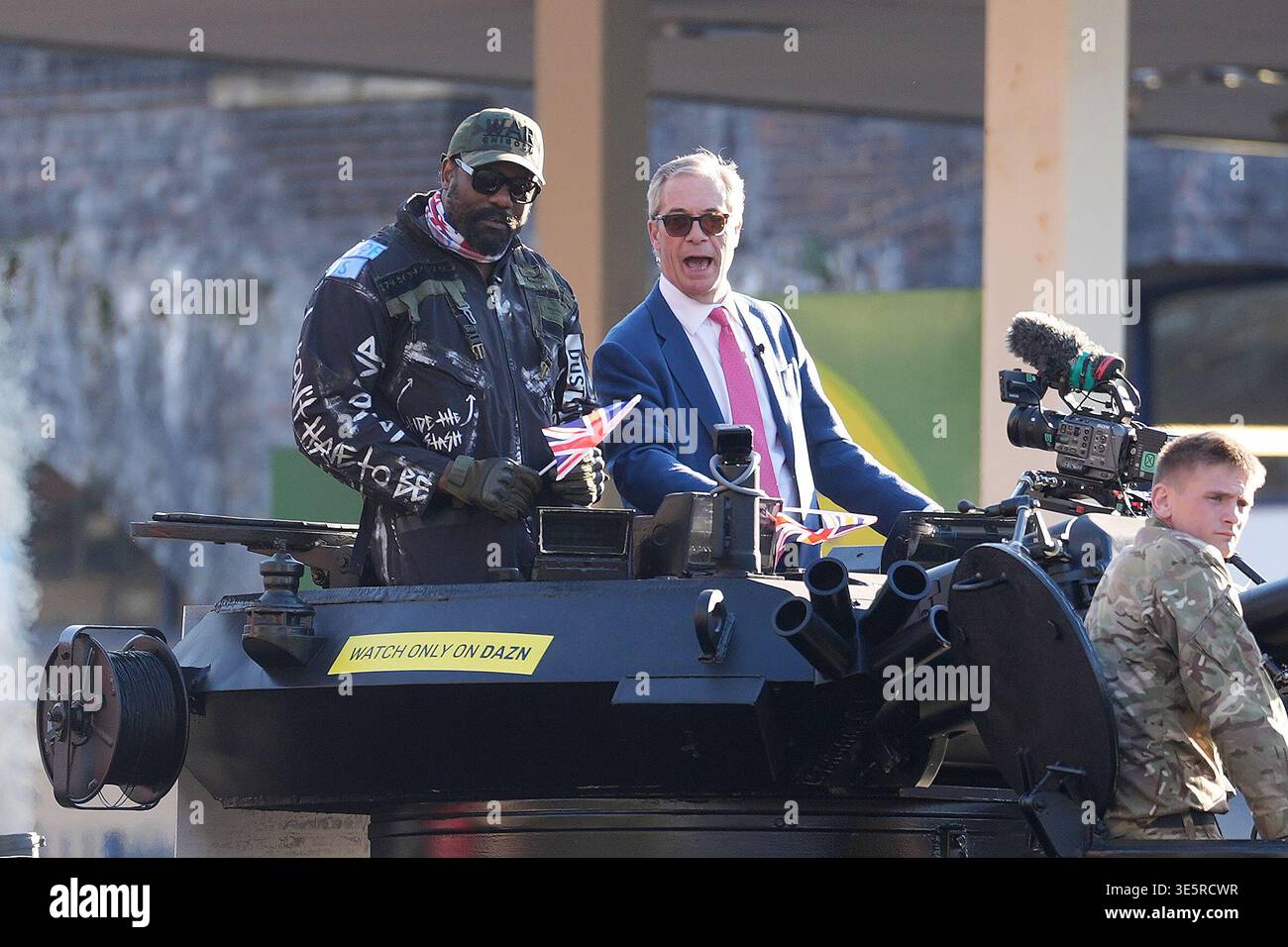 Derek Chisora (left) arrives with Reform UK leader Nigel Farage on top ...