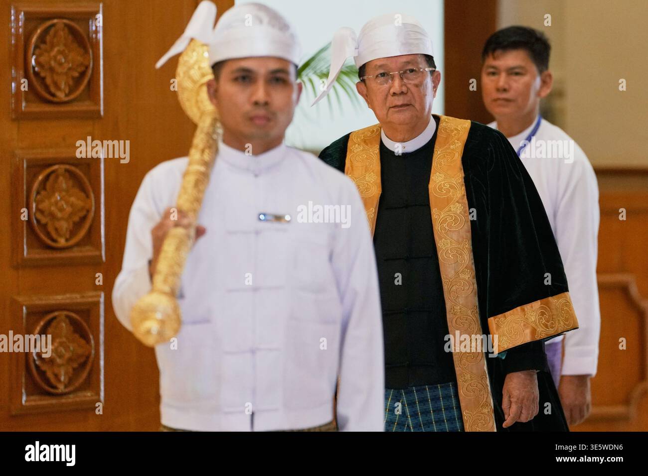 Parliament chairman Aung Lin Dwe, center, arrives for a session of ...