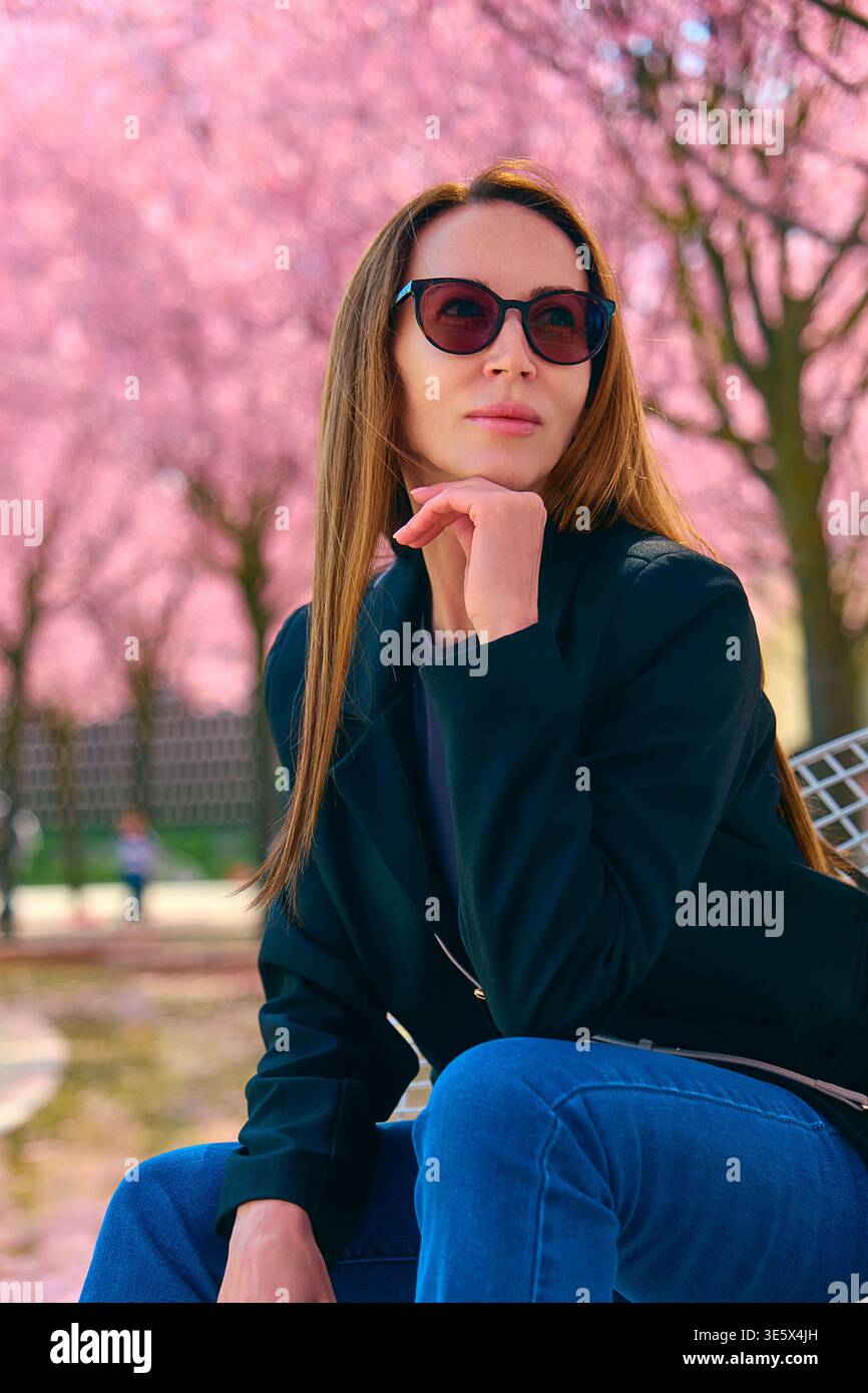 girl walks through a spring park with flowering trees Stock Photo - Alamy