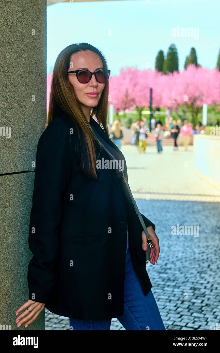 girl walks through a spring park with flowering trees Stock Photo - Alamy