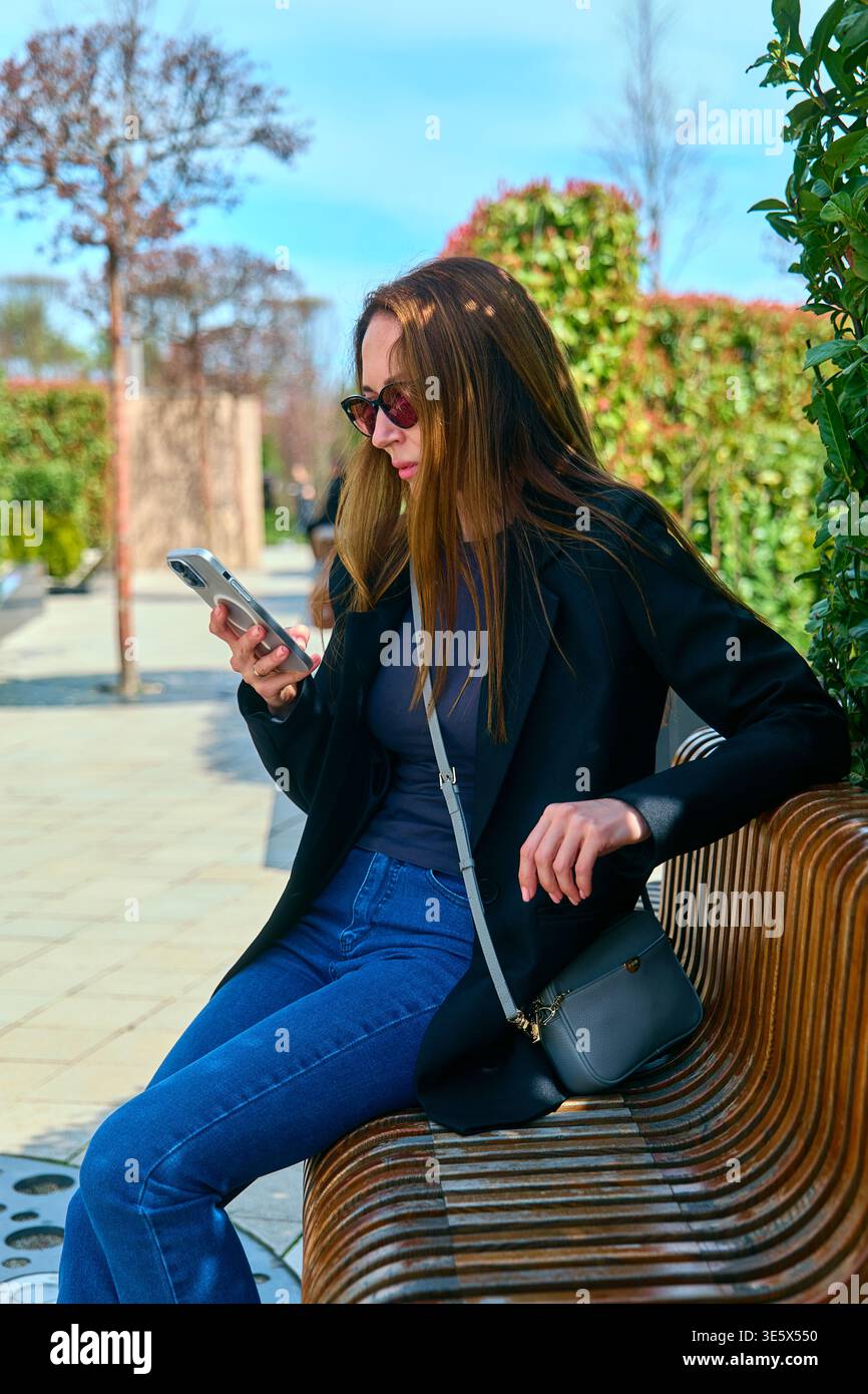girl walks through a spring park with flowering trees Stock Photo - Alamy