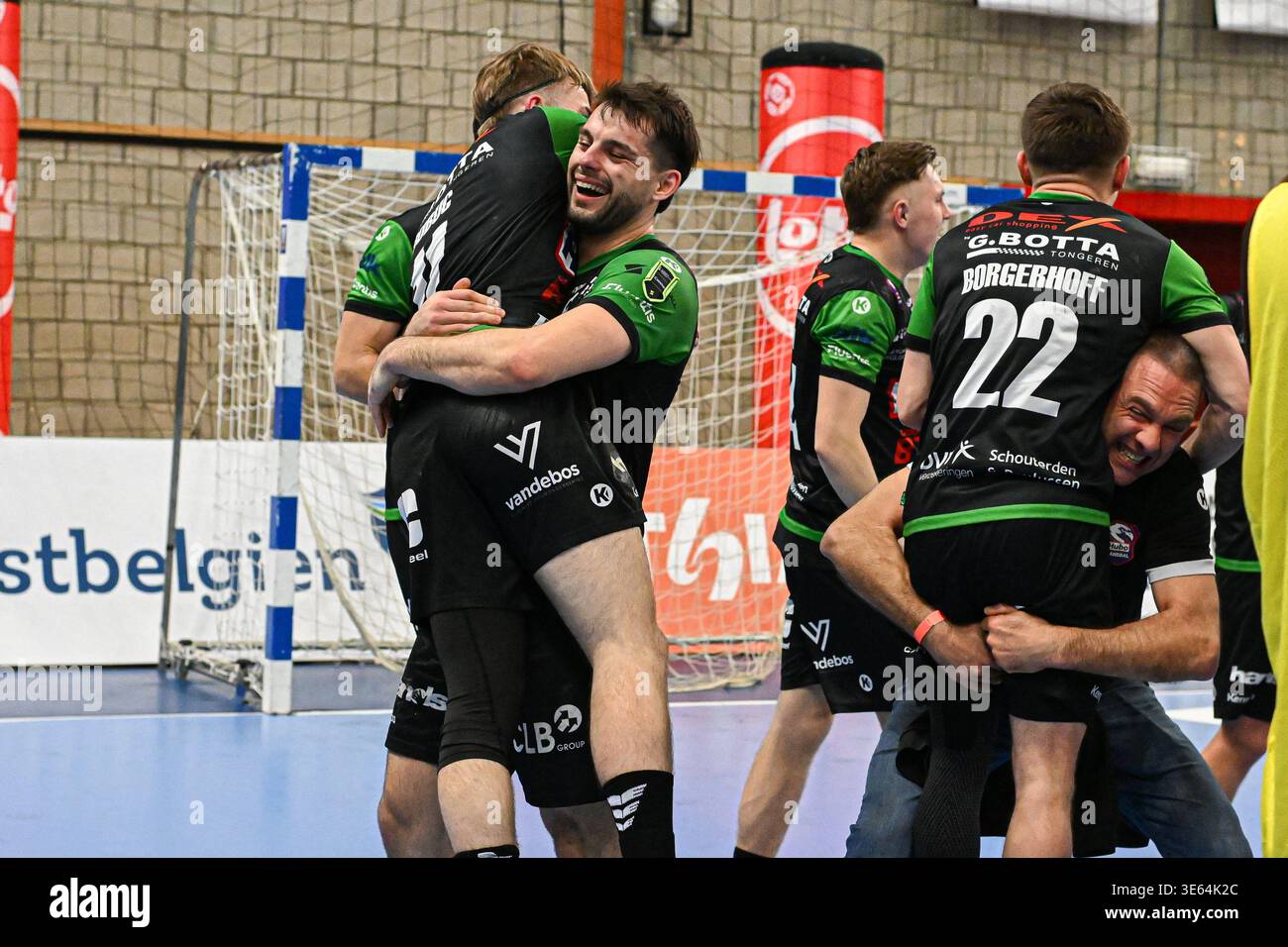 Hubo Handbal's players celebrate after winning a handball game between ...