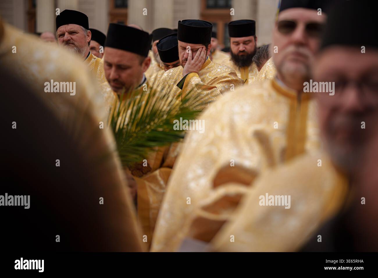 Romanian Orthodox priests stand outside the Patriarchal Cathedral after ...