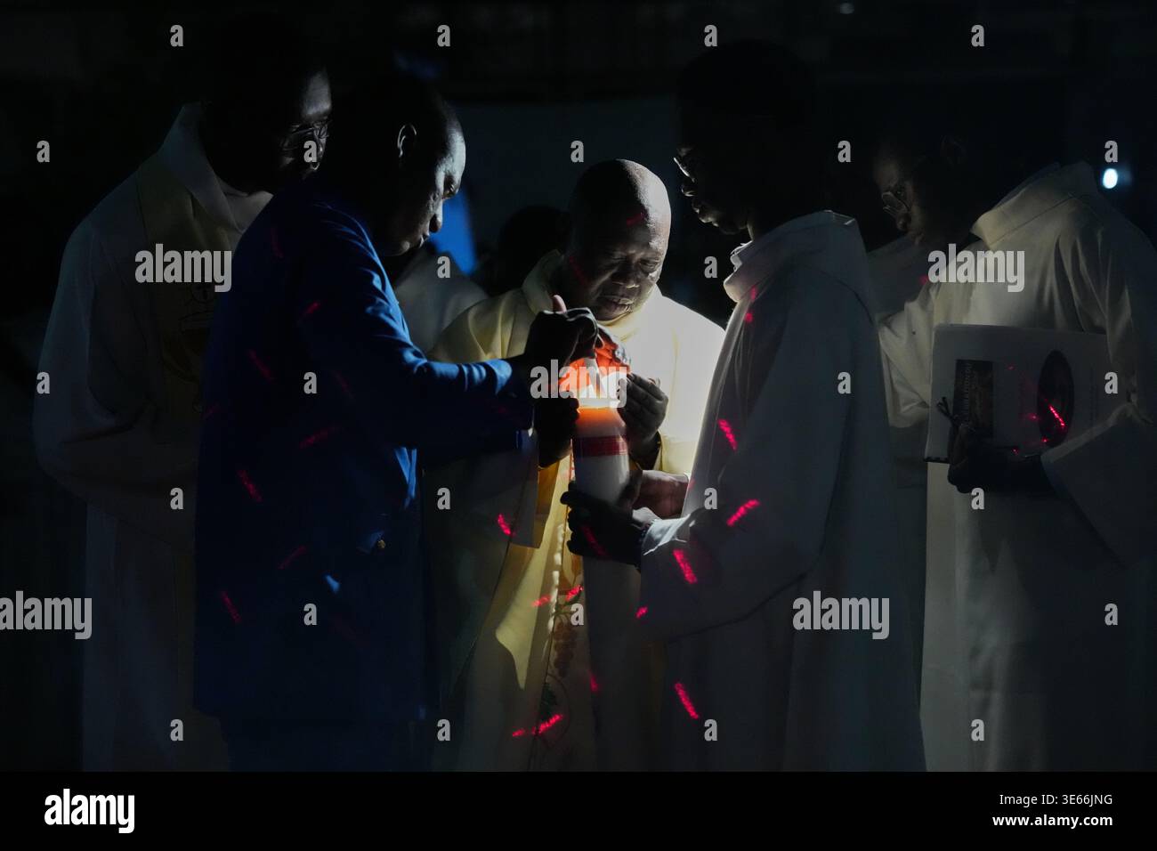 Worshippers light candles at Our Lady of the Angels Church during the ...