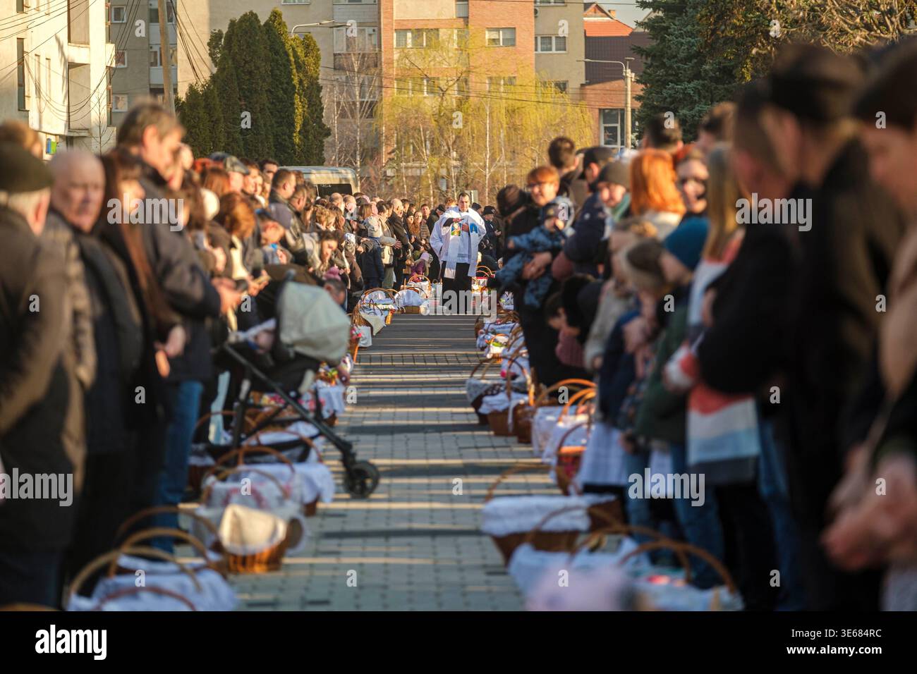 Ethnic Hungarians stand behind their Easter baskets brought to be ...