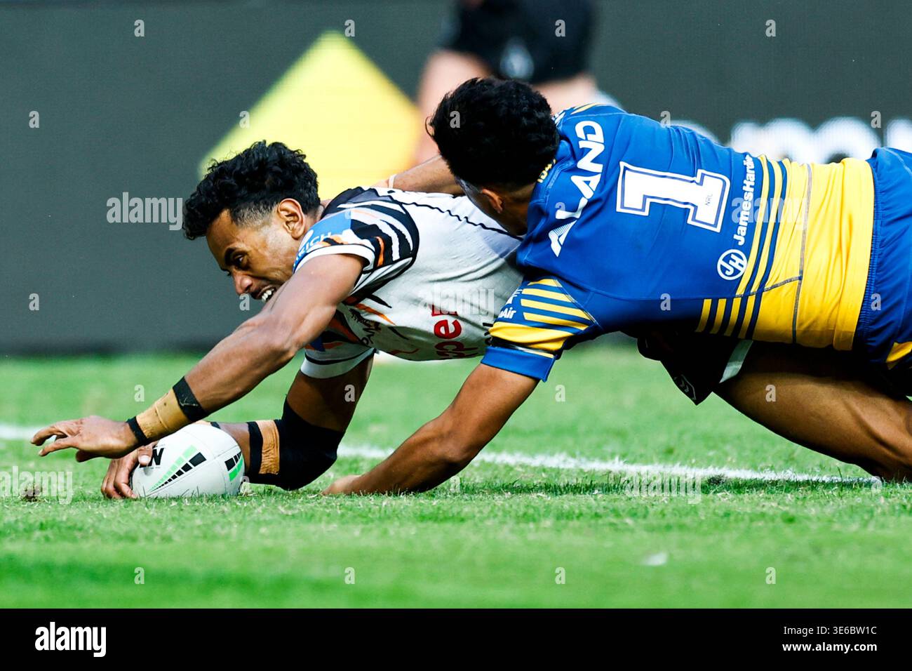Jahream Bula of the Tigers scores a try during the NRL Round 5 match ...