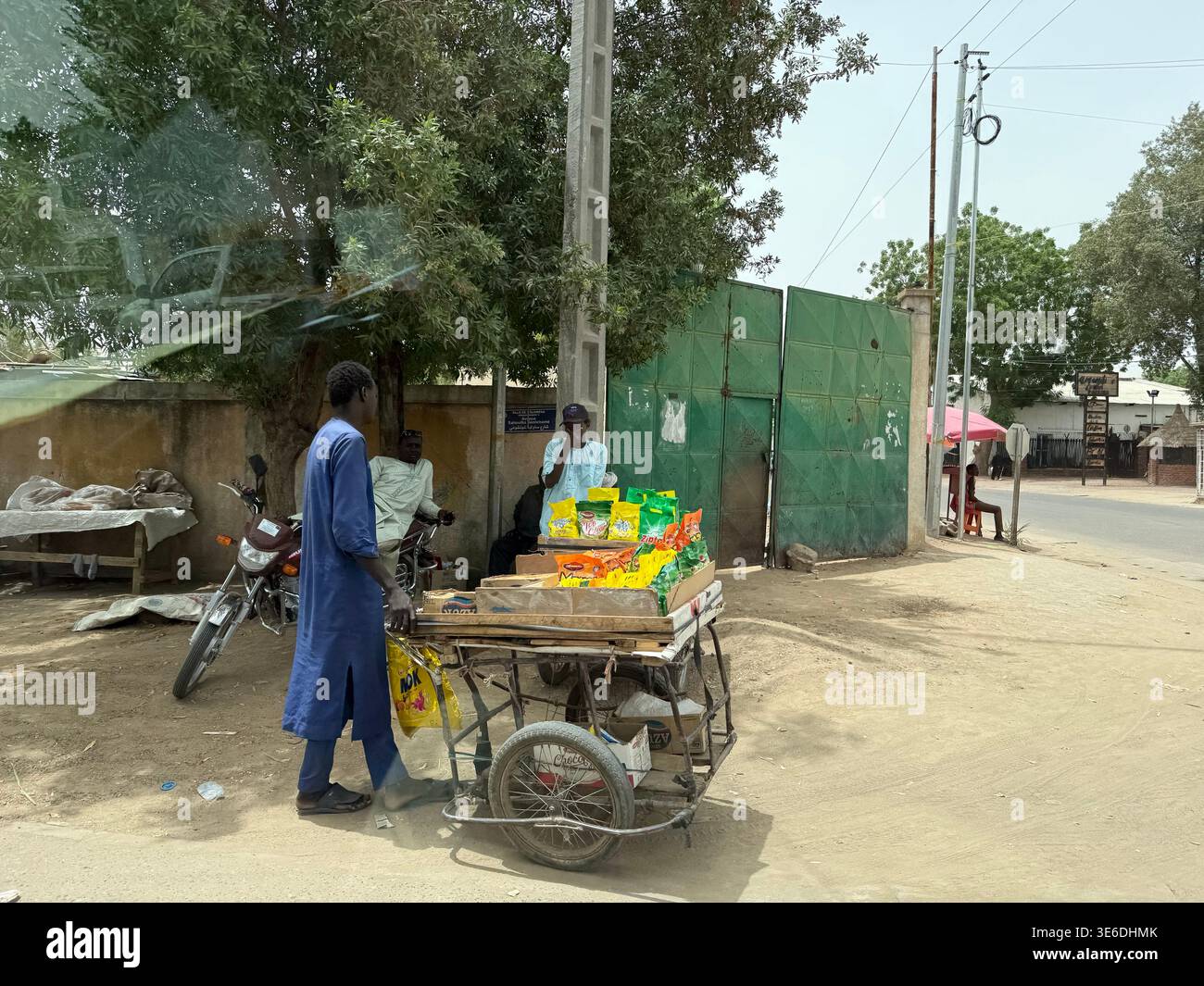 06 April 2026, Chad, N´Djamena: Small traders wait for customers on the ...