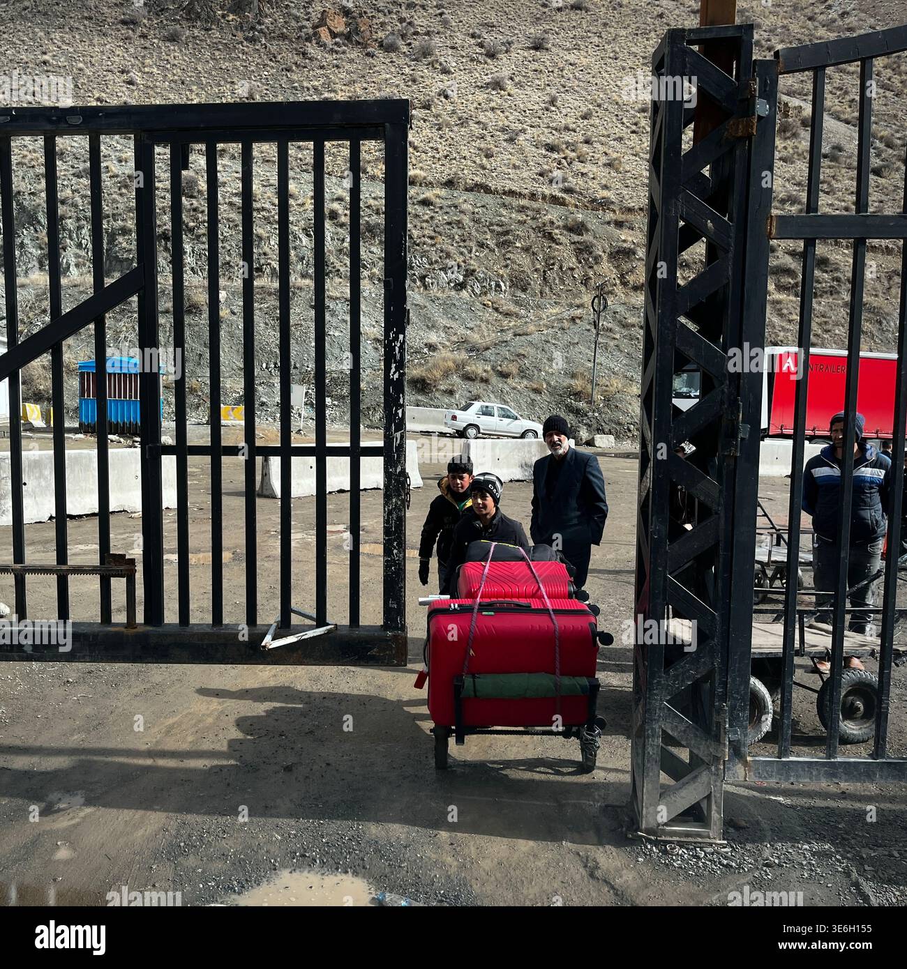 Travelers arrive at a border crossing between Turkey and Iran in Razi ...