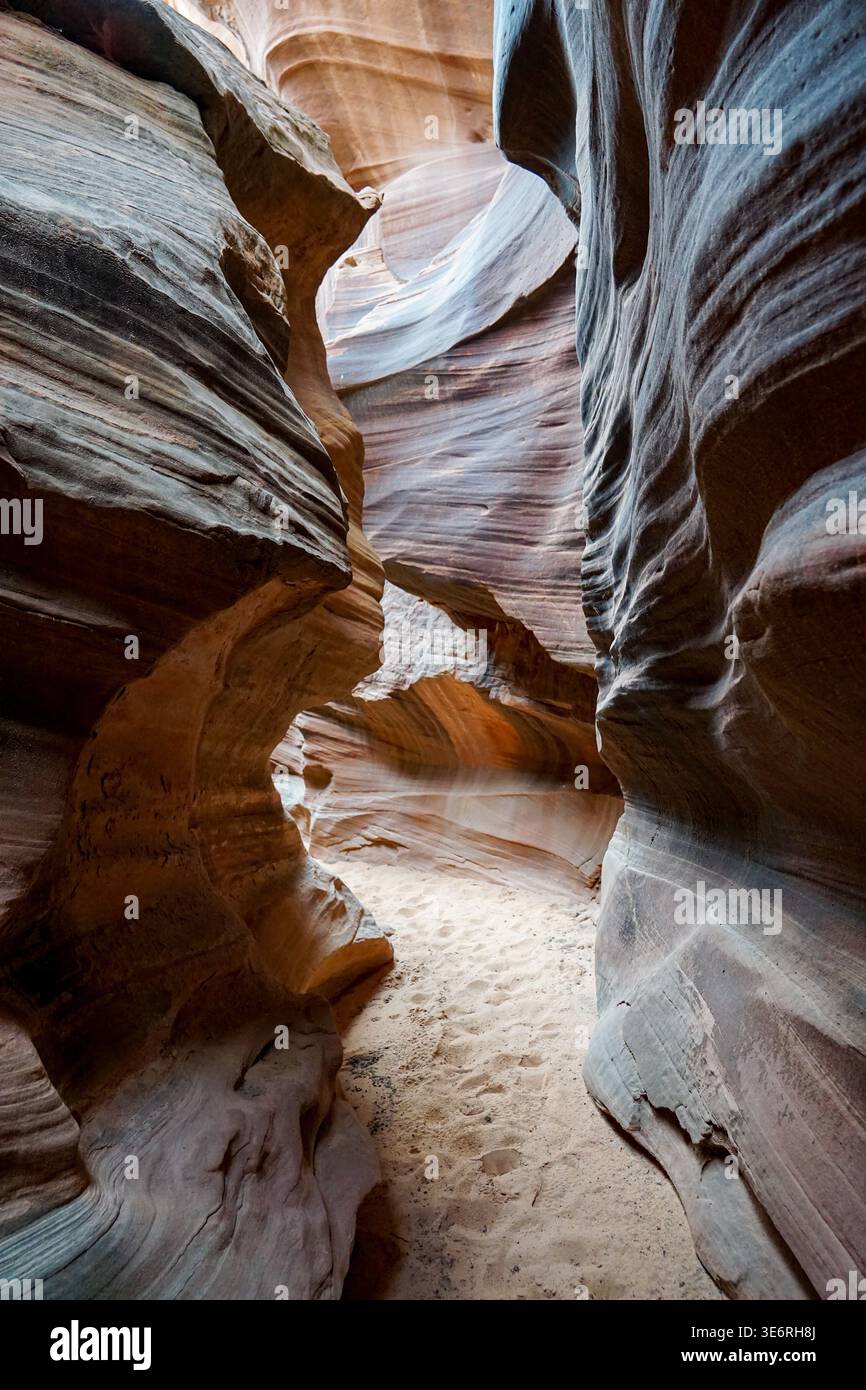 Winding slot canyon pathway through eroded sandstone walls hi-res stock ...