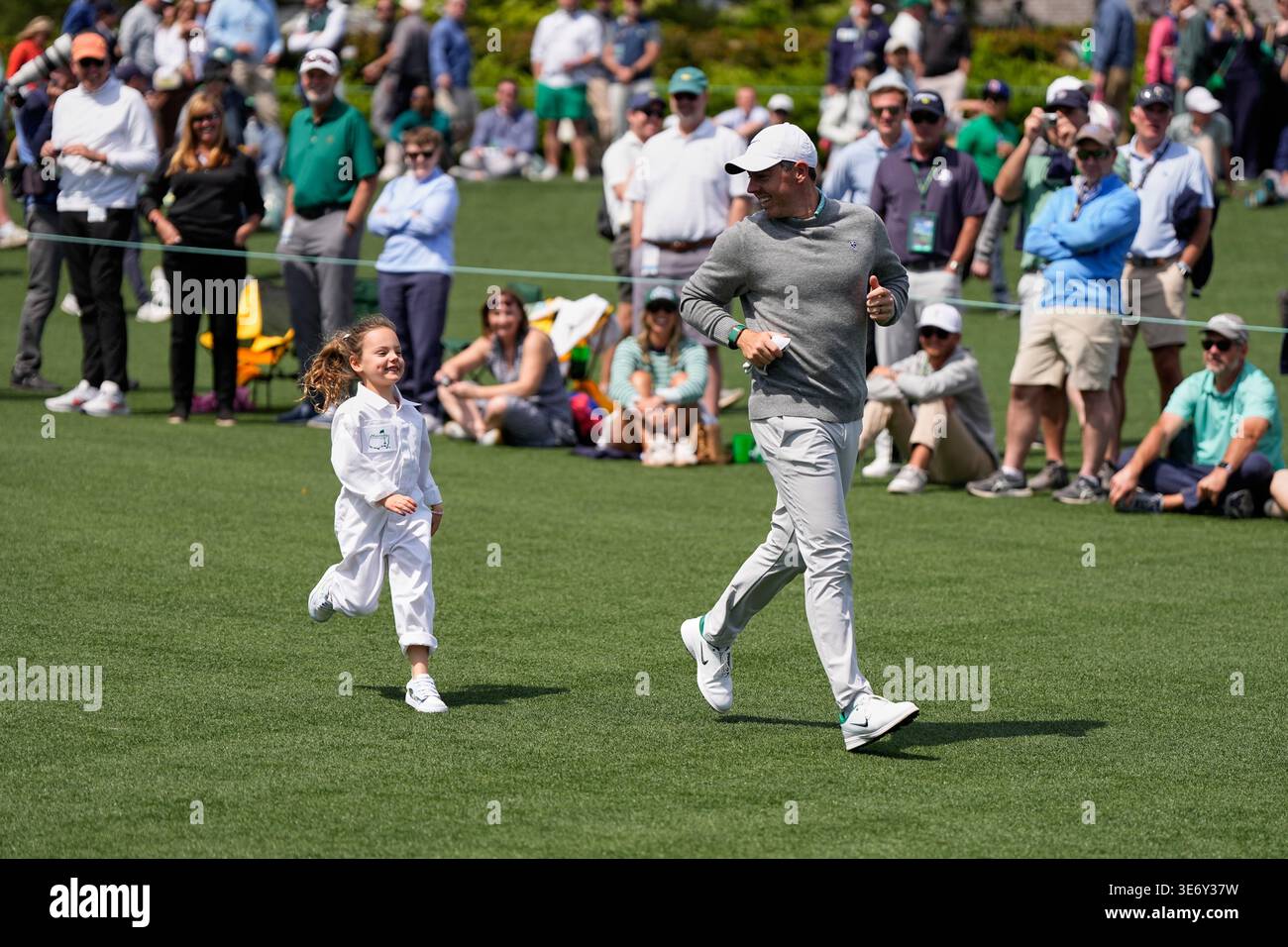 Rory McIlroy, right, runs with his daughter, Poppy, during par-3 ...
