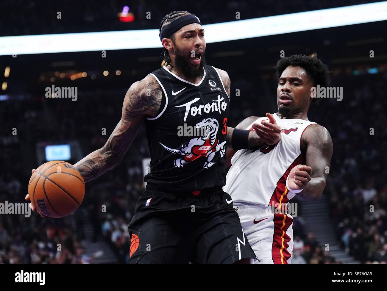 Toronto Raptors' Brandon Ingram (3) protects the ball from Miami Heat's ...