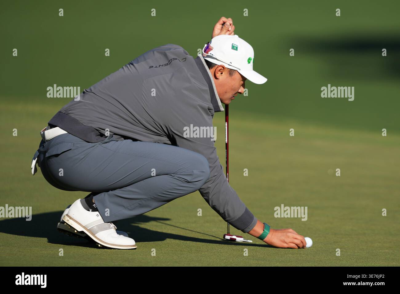 Augusta, USA. 9th Apr, 2026. Li Haotong of China lines his putt during ...