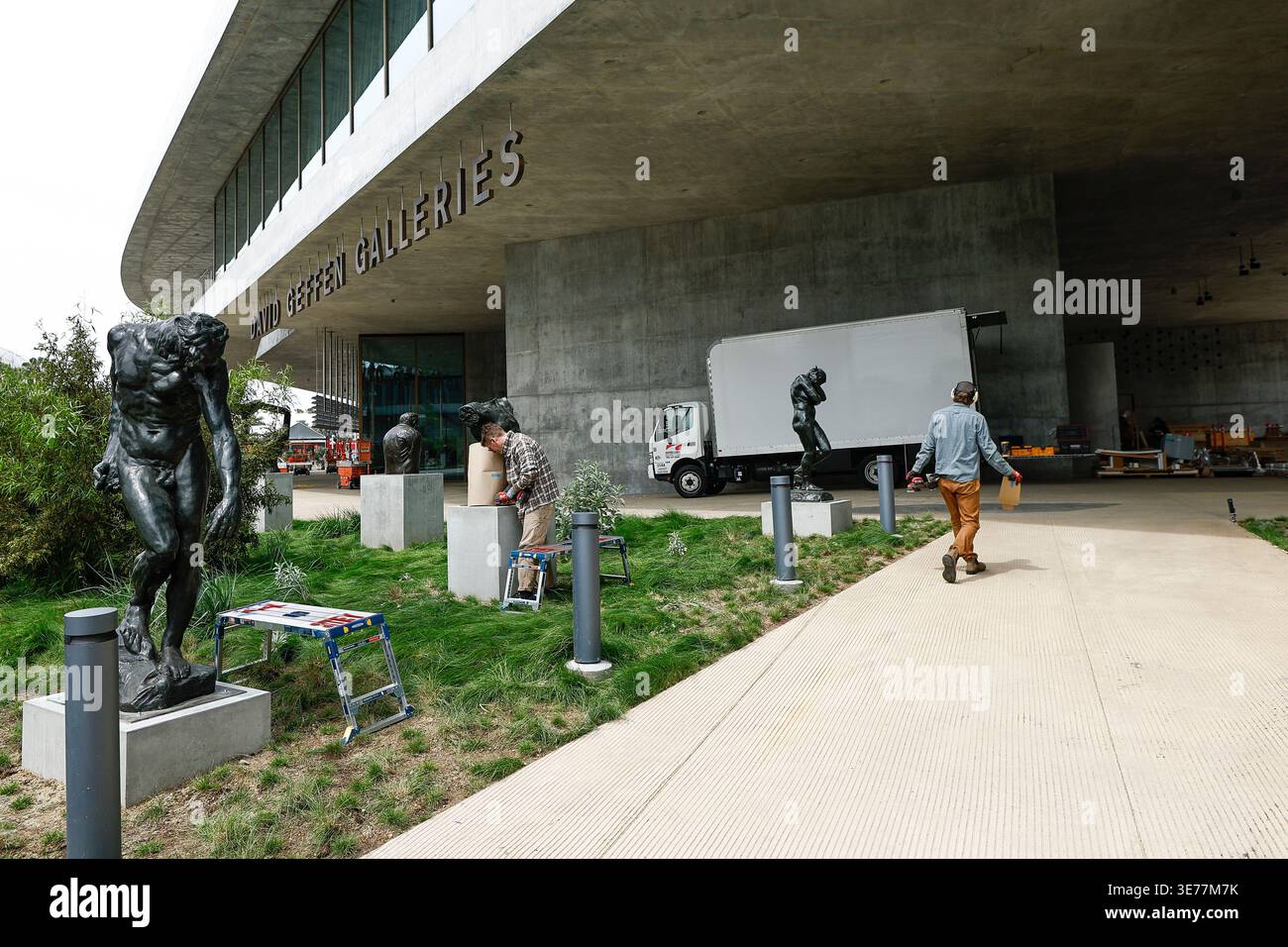 Workers make final adjustments outside the David Geffen Galleries at ...