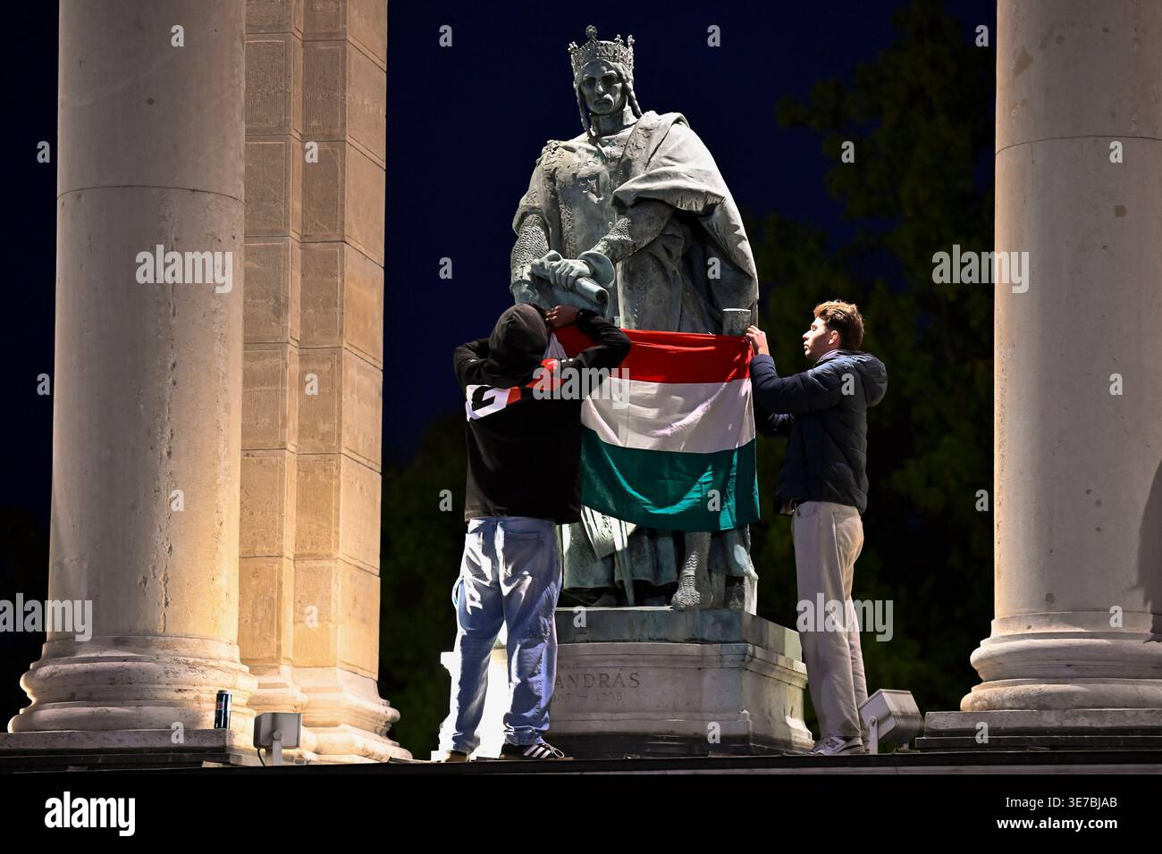 People hang a Hungarian flag on a statue during an anti-government ...