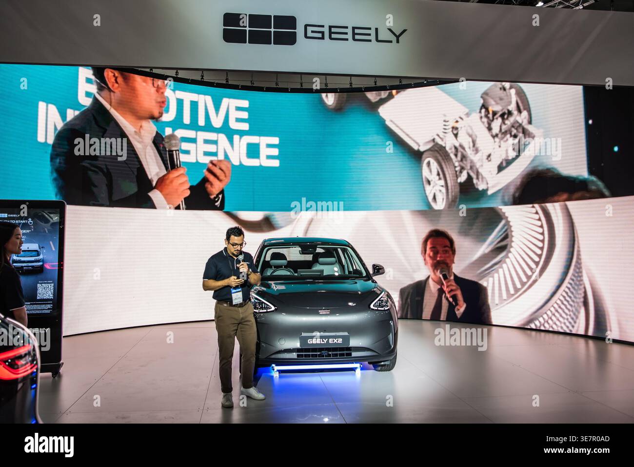 Ashur Varde, Product Manager of Geely is seen presenting EX2 model ...