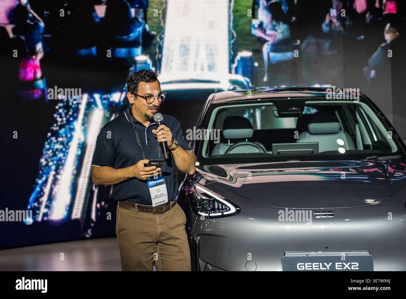 Ashur Varde, Product Manager of Geely is seen presenting EX2 model ...