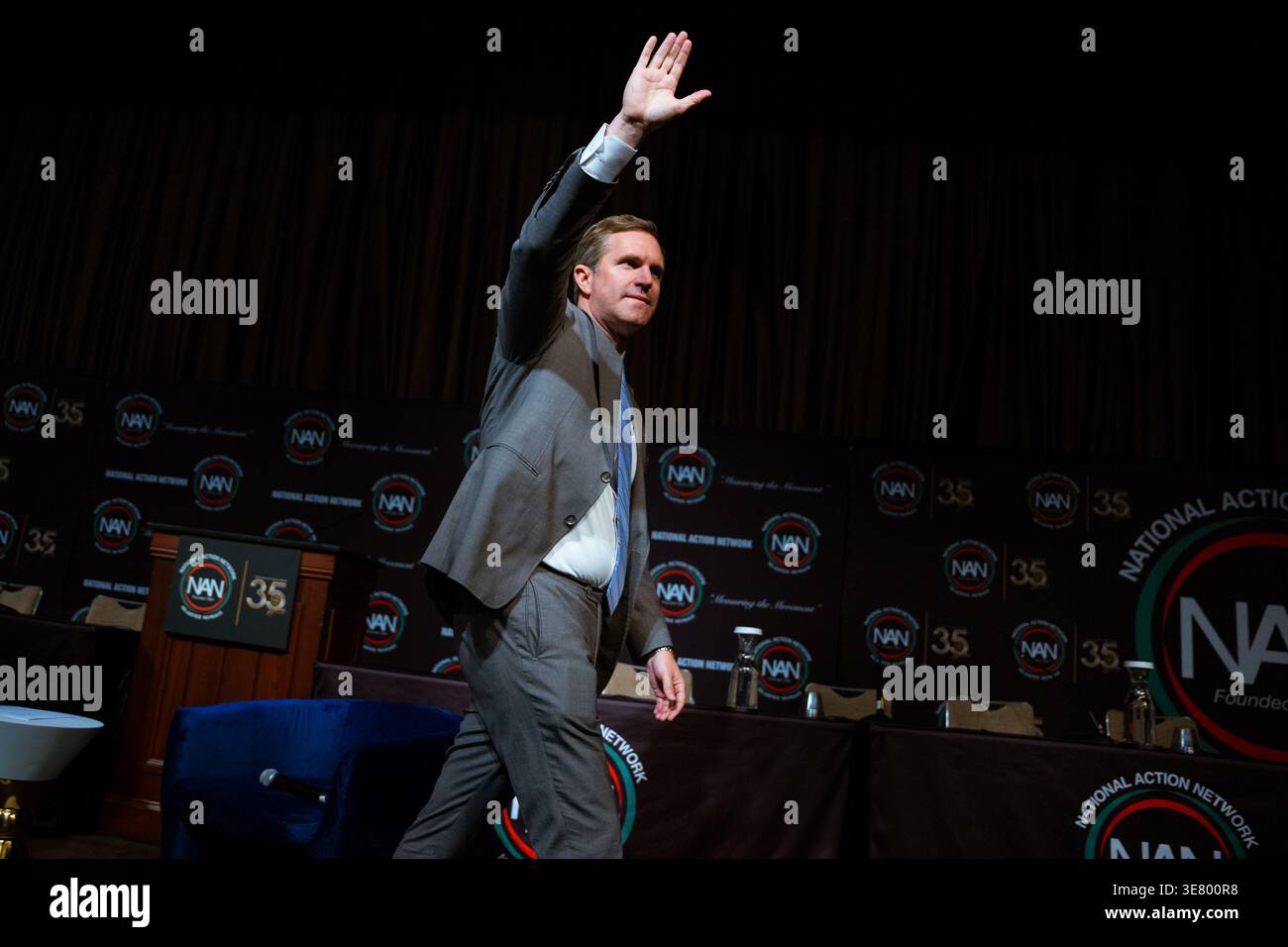 Kentucky Gov. Andy Beshear waves goodbye to the audience as he exits at ...