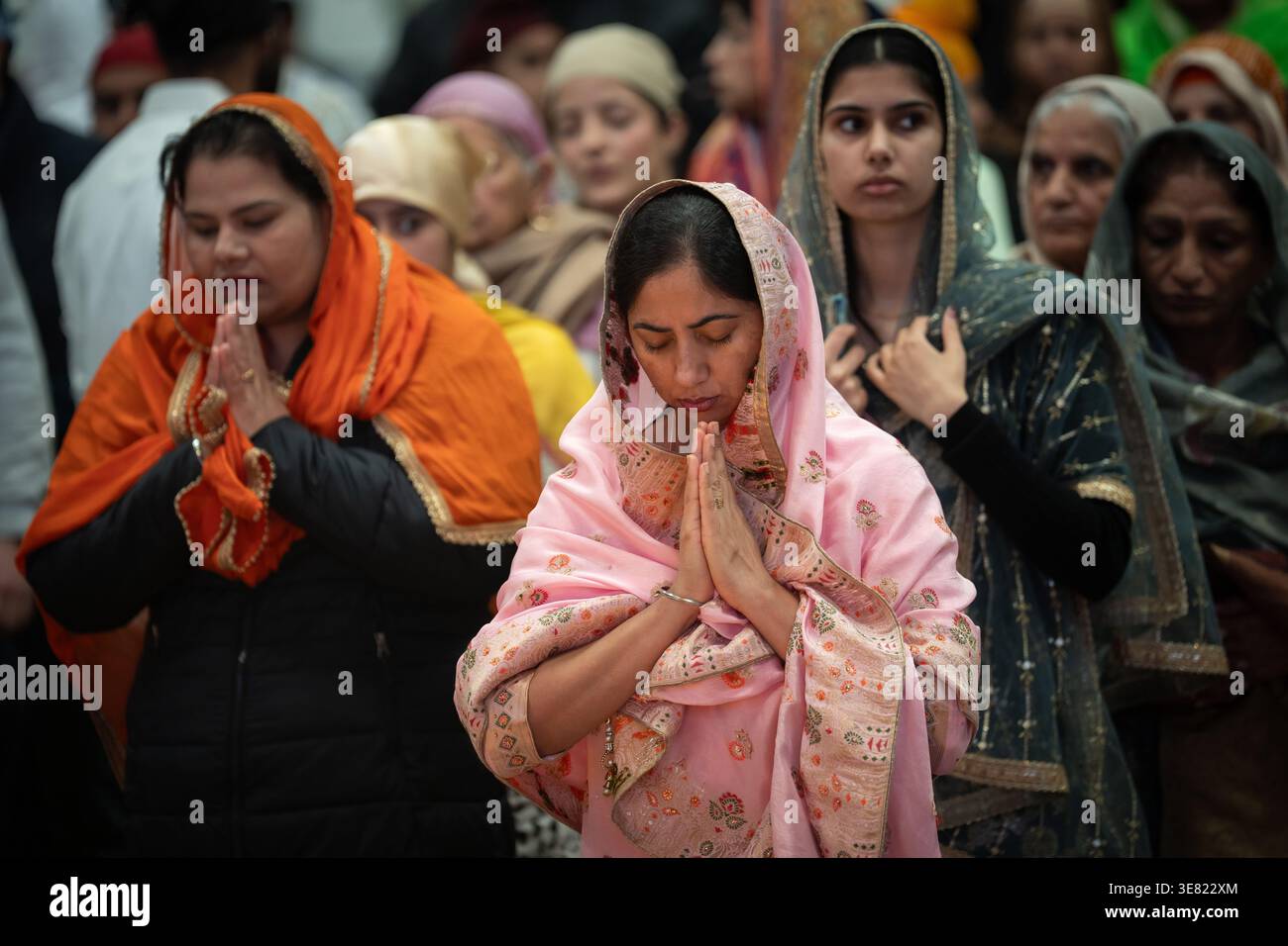 A woman pauses at the Khalsa Diwan Society Sikh temple before the ...