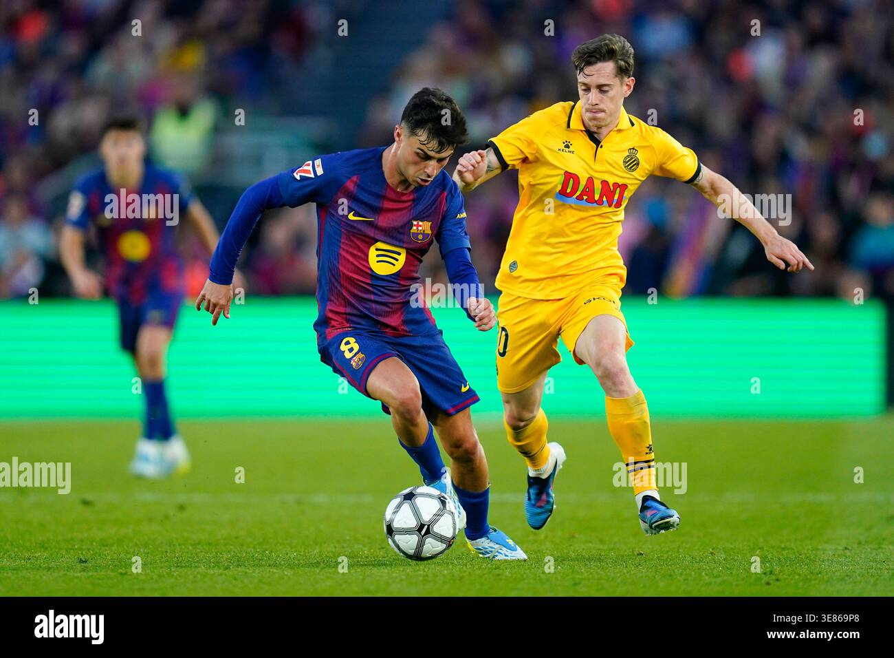 Pedro Gonzalez Pedri of FC Barcelona and Pol Lozano of RCD Espanyol ...