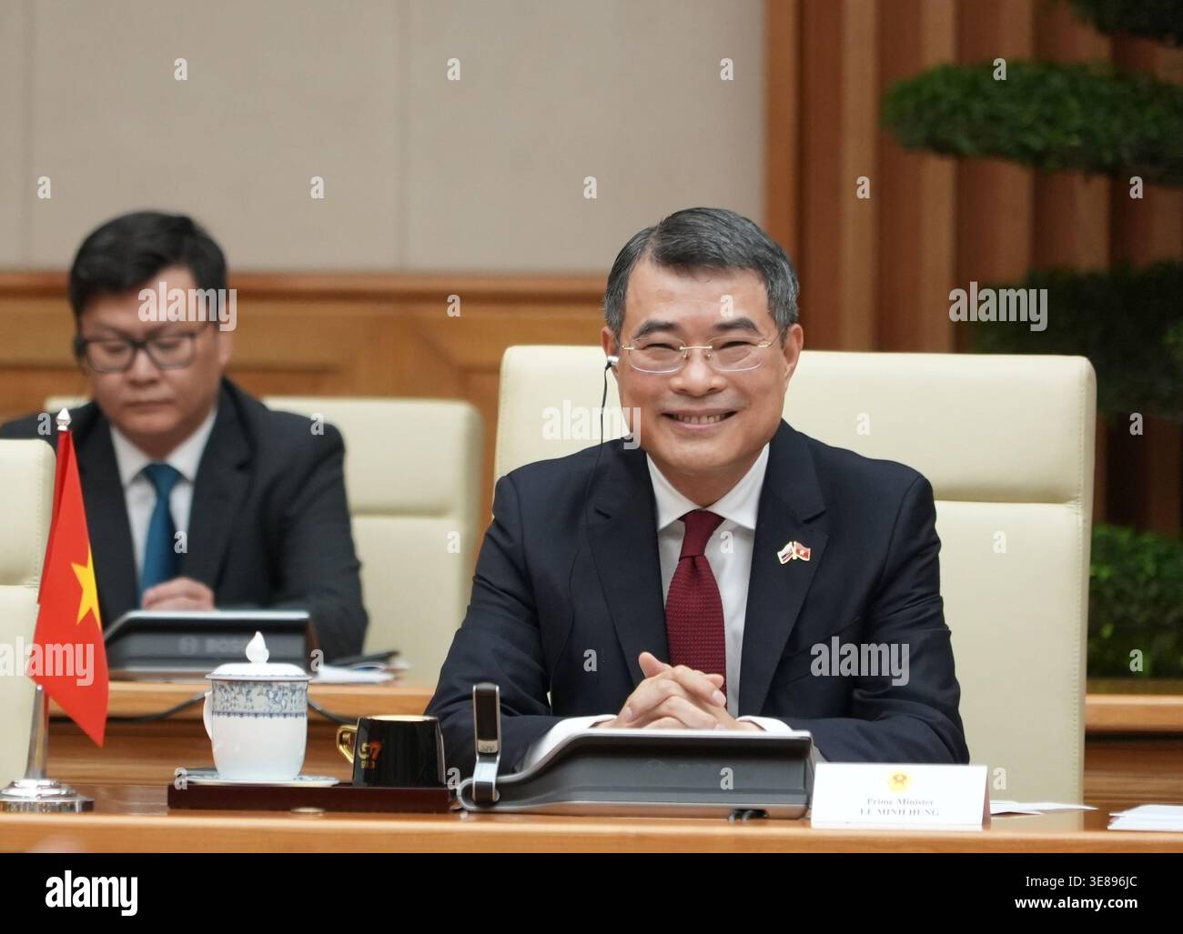 Vietnamese Prime Minister Le Minh Hung reacts during a meeting with ...